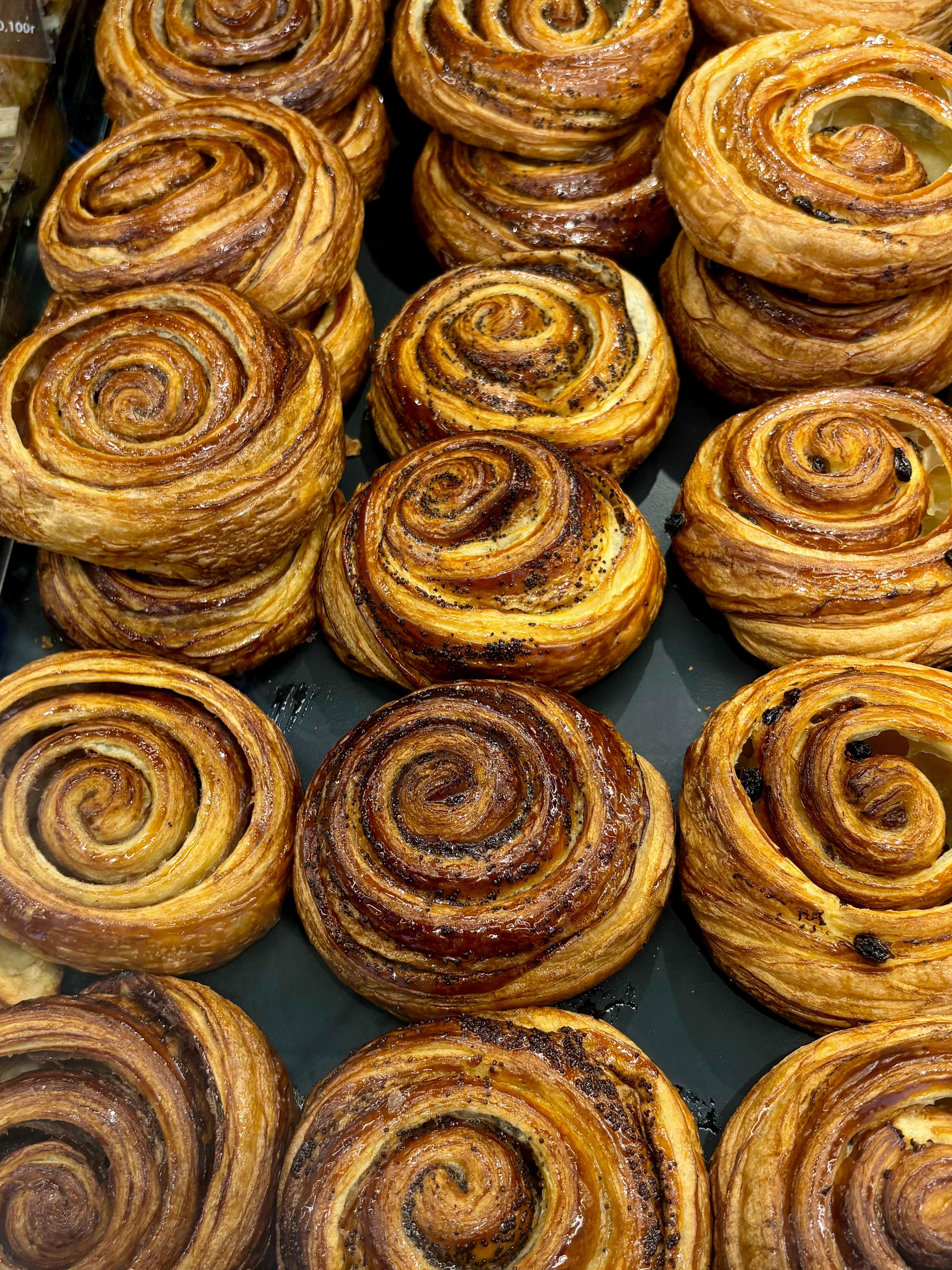 Cinnamon Spiral Delights: A Tray of Glazed Pastries