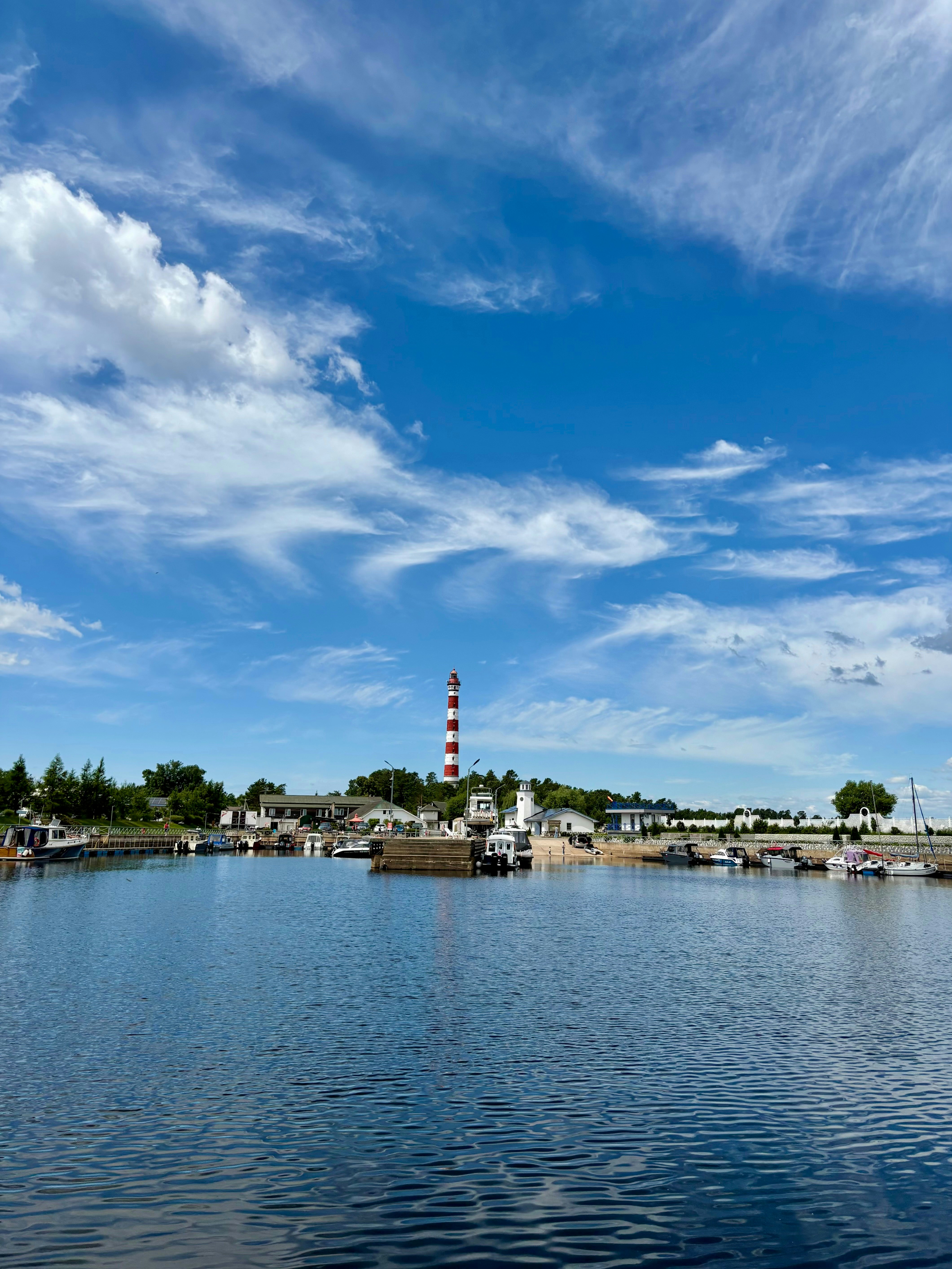 Harbor Light: A Quiet Waterfront Under Wide Sky