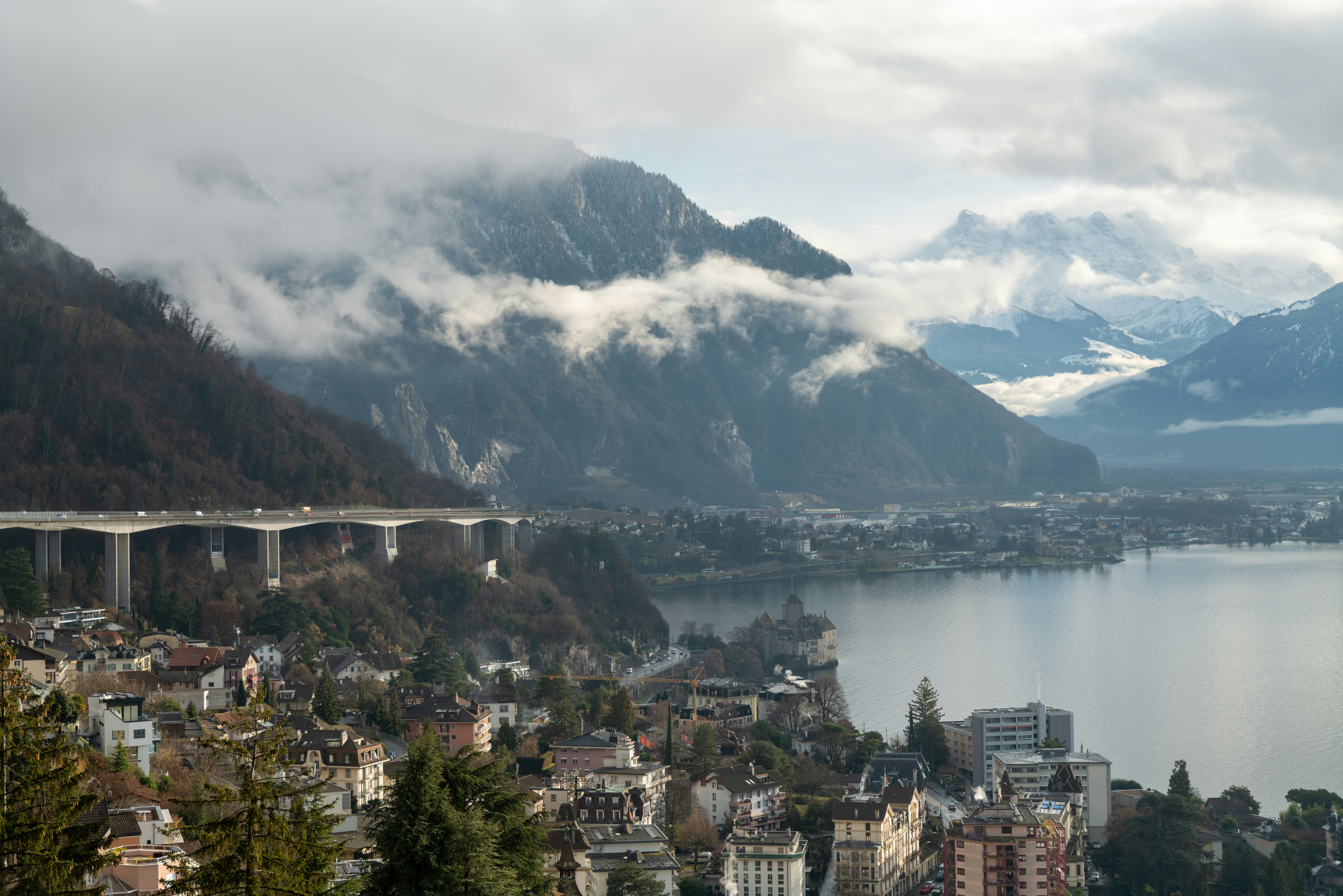 Lake Geneva Panorama: Coastal Town and Alpine Bridge