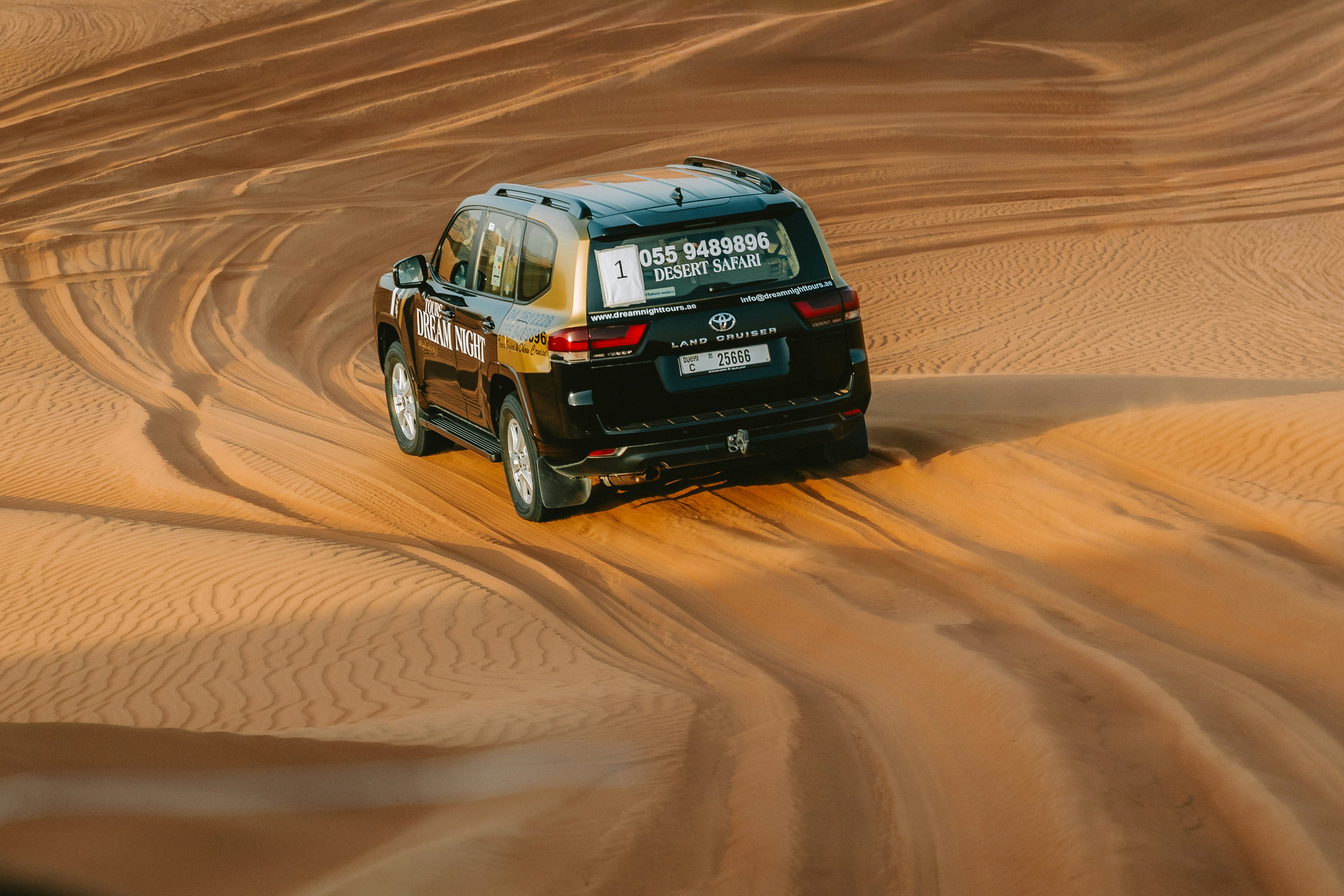 Desert Rally: SUV carving dusty arcs across sunlit dunes