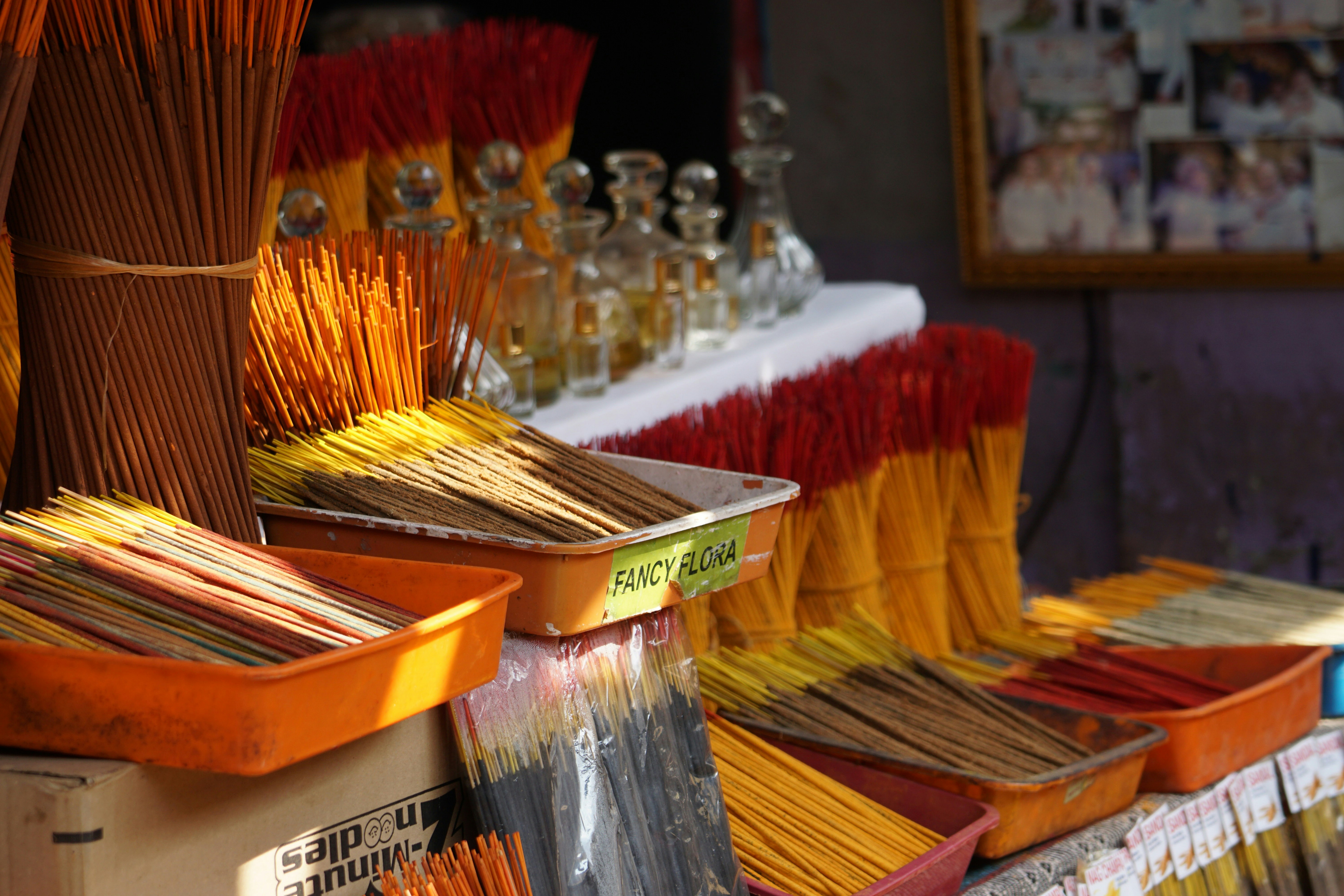 Vibrant Stacks of Incense at a Market Stall