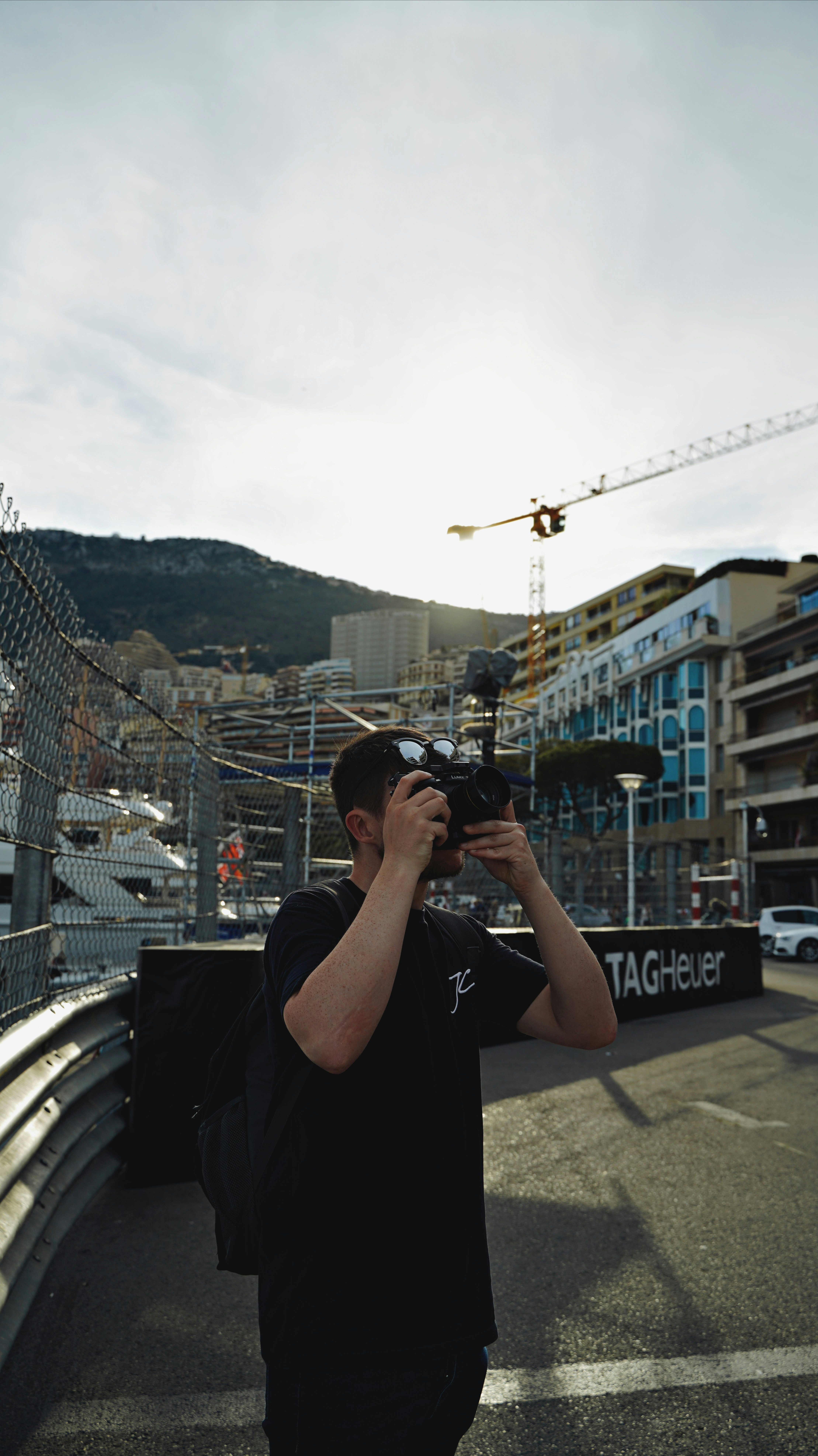 Photographer in the City Circuit: Capturing Moment Behind the Fence