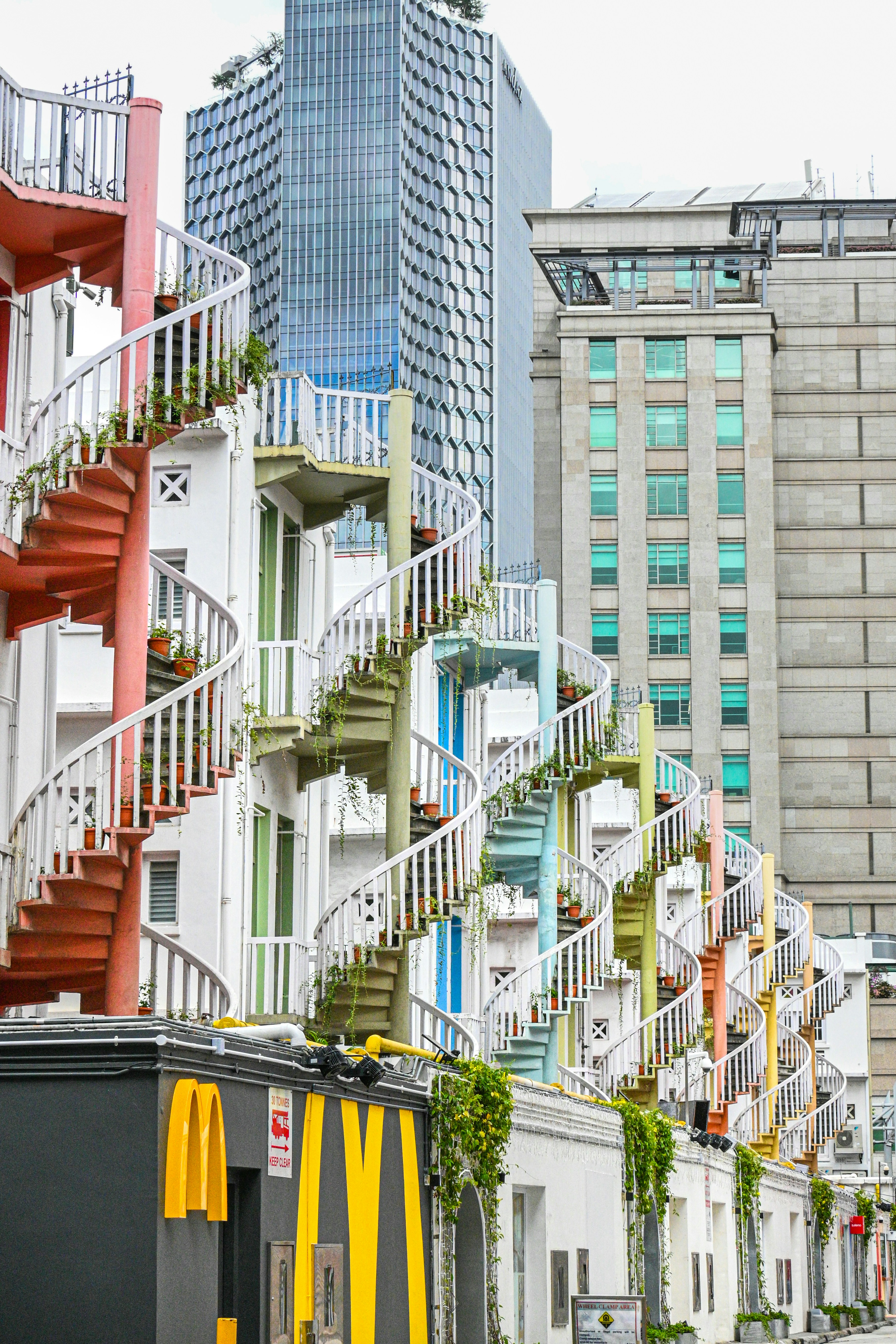 Spiral Staircase Mosaic: Colorful Fire Escape Worlds in a City