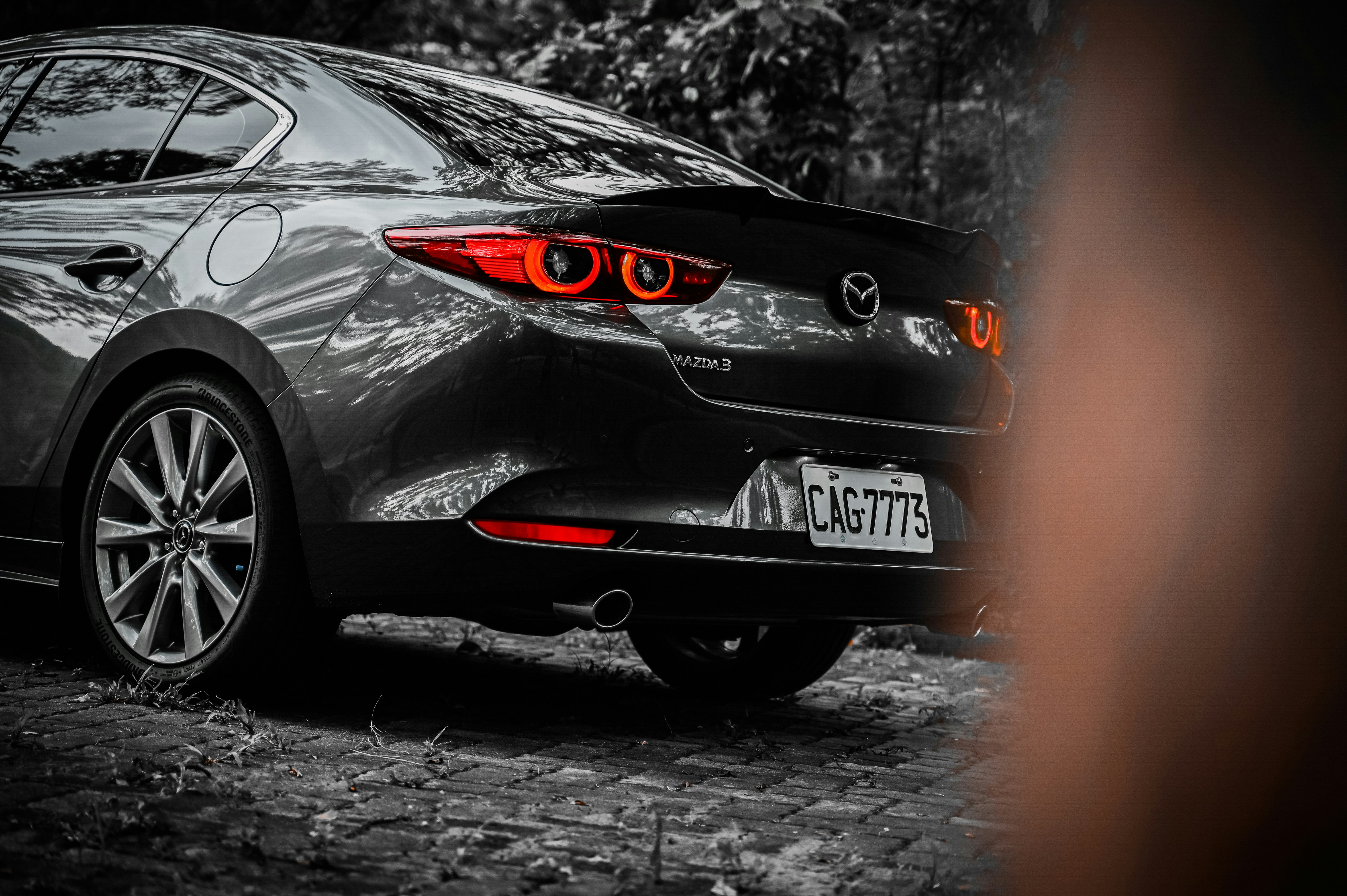Tail-lights in Focus: A Mazda's Quiet Exit