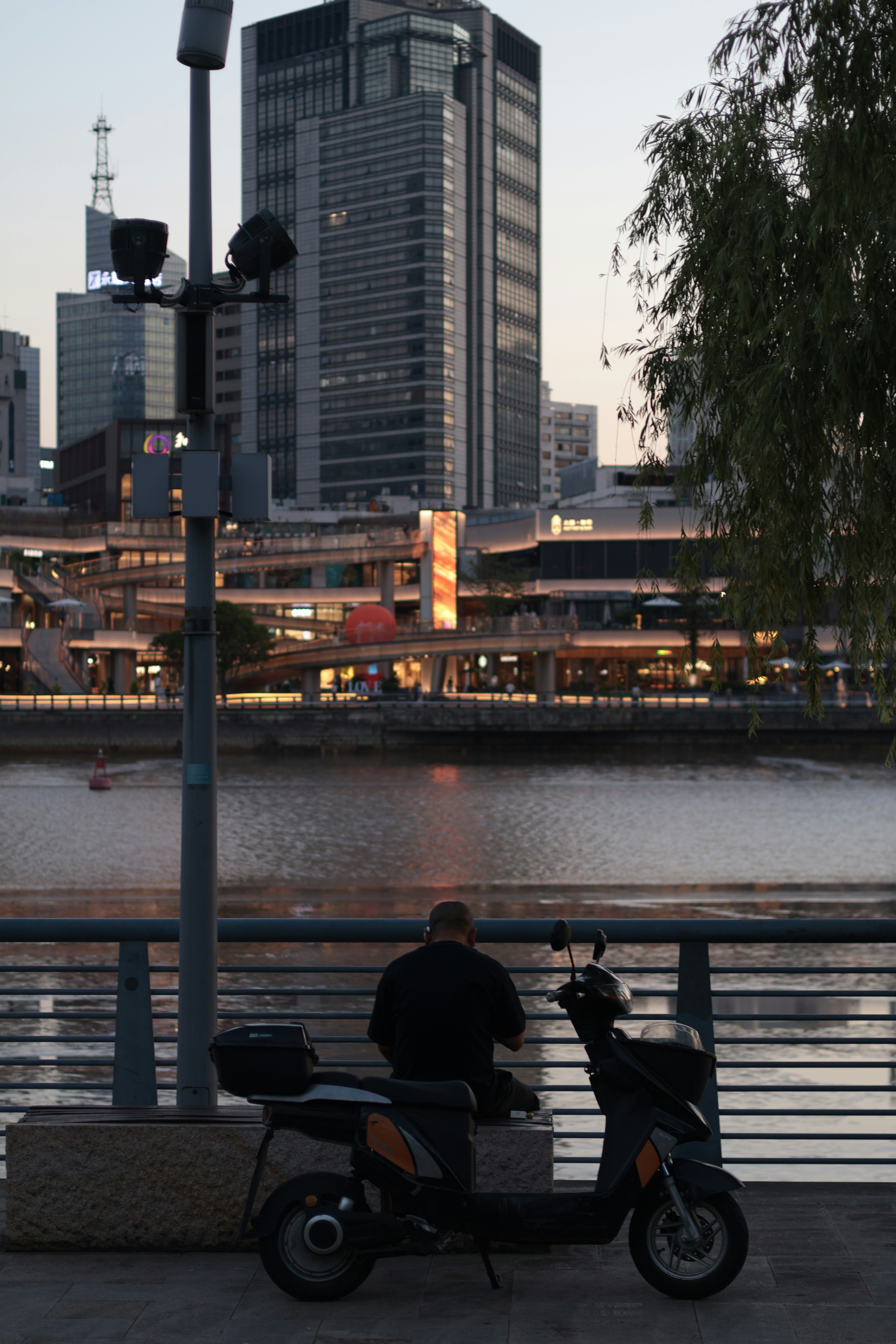 Riverside Quiet: A Rider, The City, and Dusk