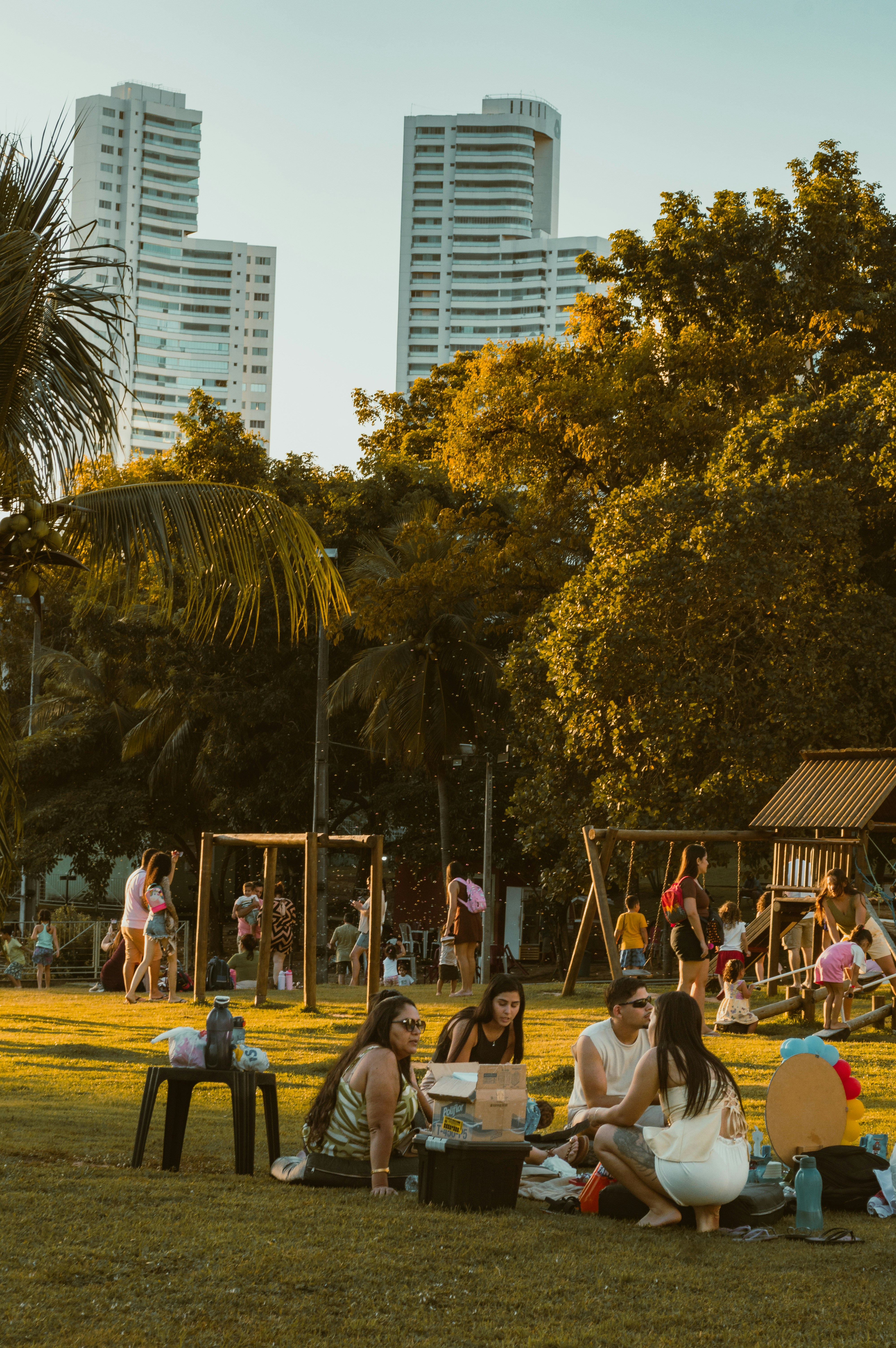 Sunlit Picnic in the Park Amidst City Skyscrapers