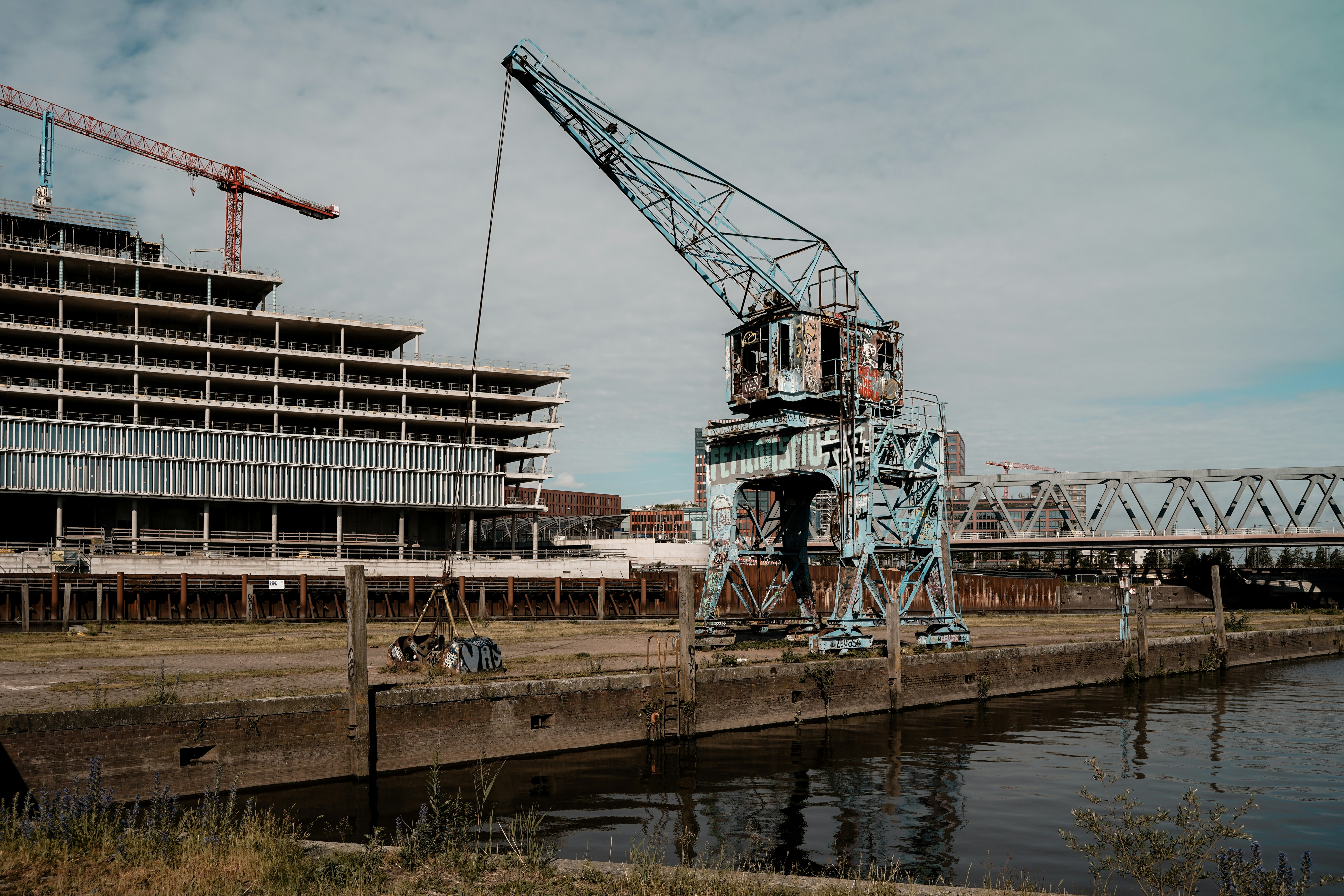 Harbor Crane Standby: Empty Construction Canvas by the Water