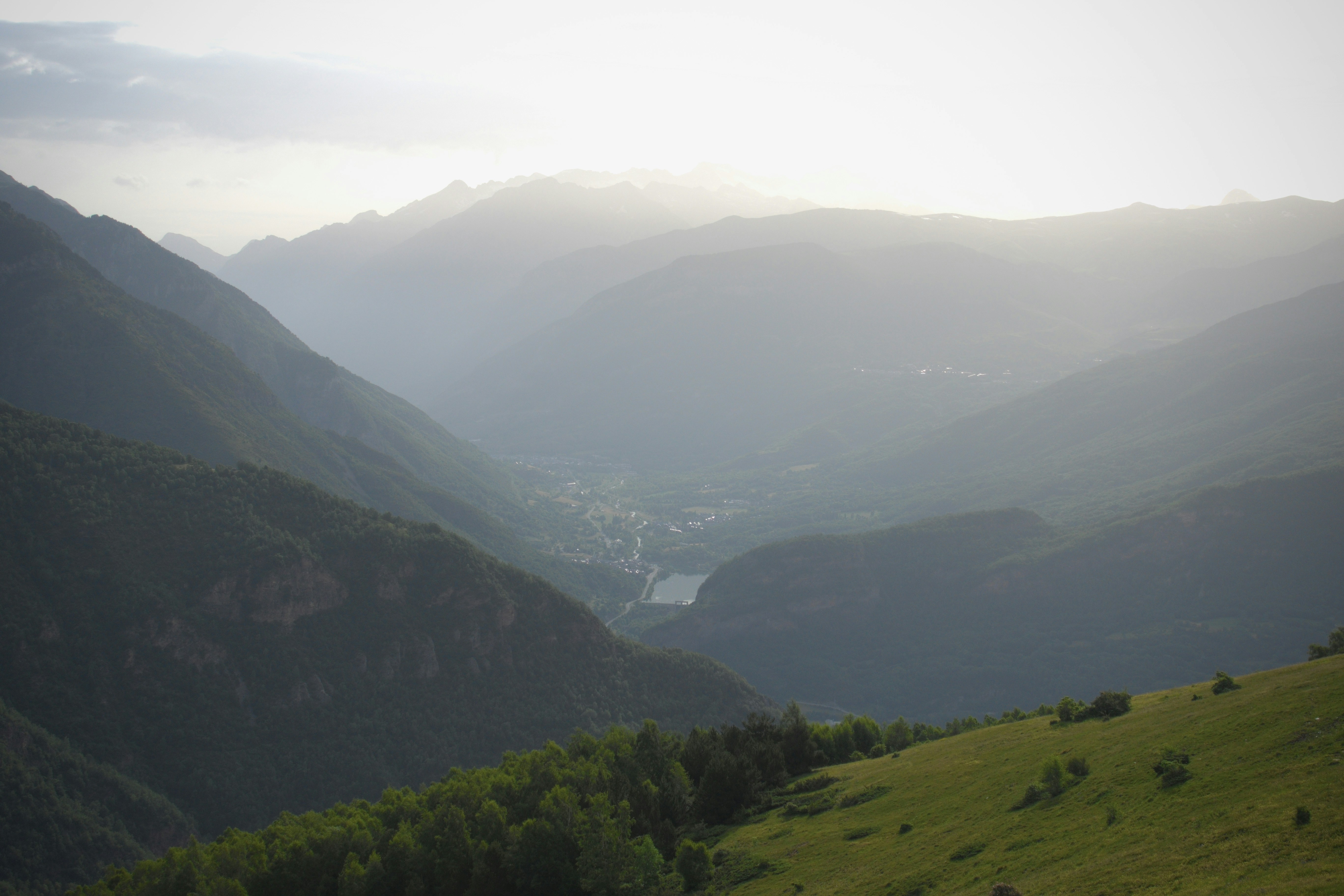 Valley Veil: Morning Light Over Misty Peaks