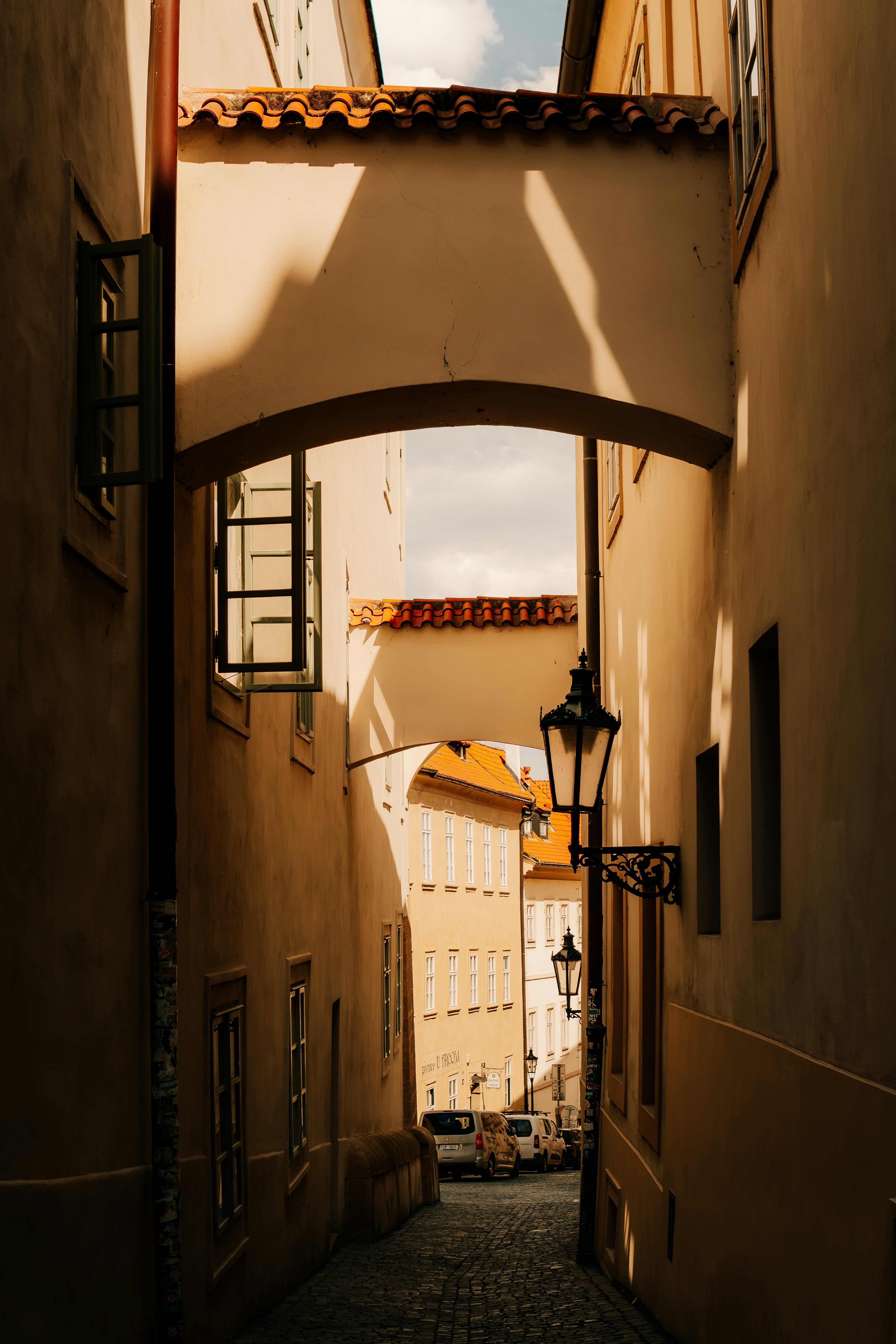 Golden Archway Through a Cobblestone Alley