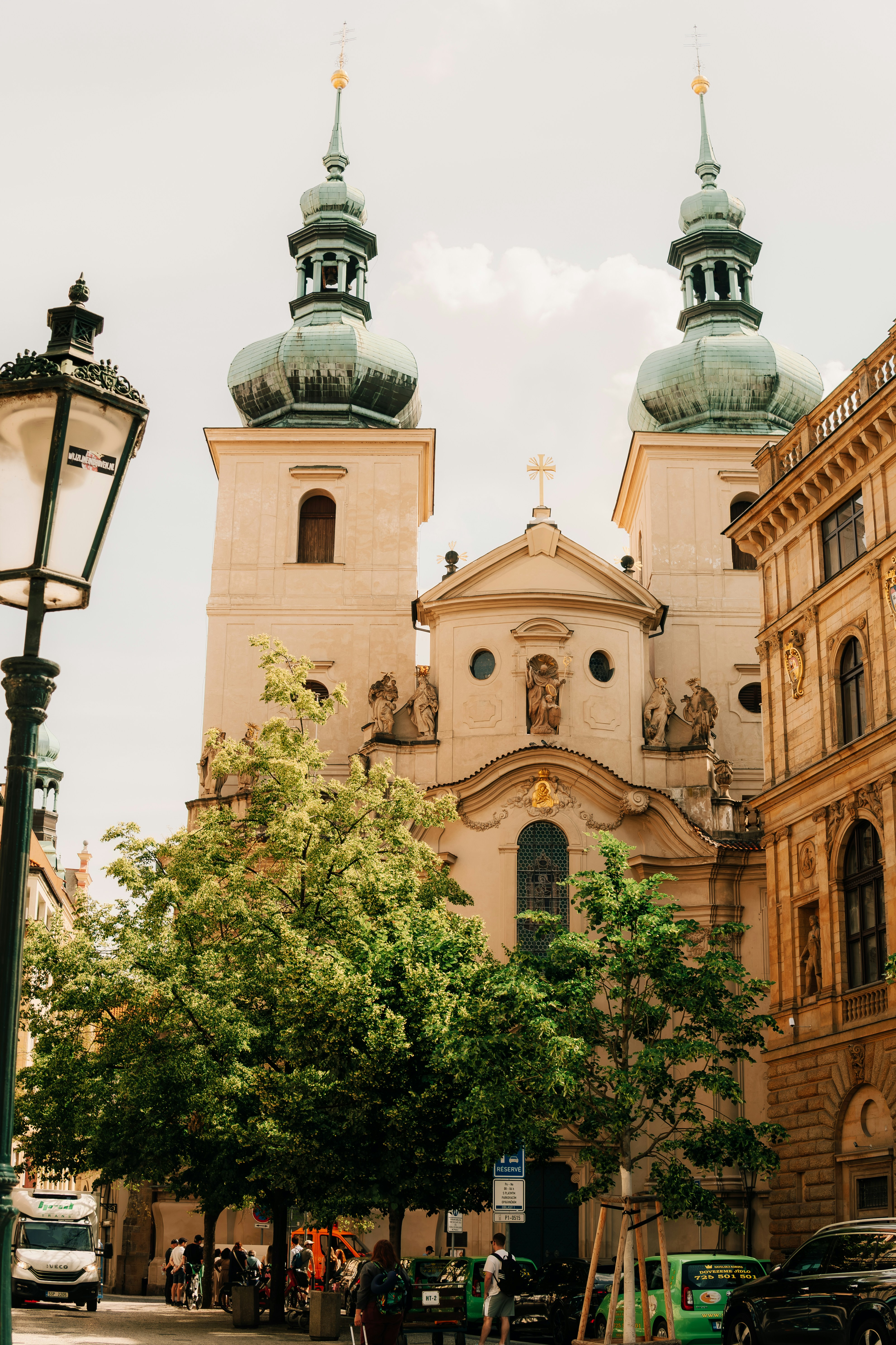 Facade of a Baroque Church Framed by Lush City Trees