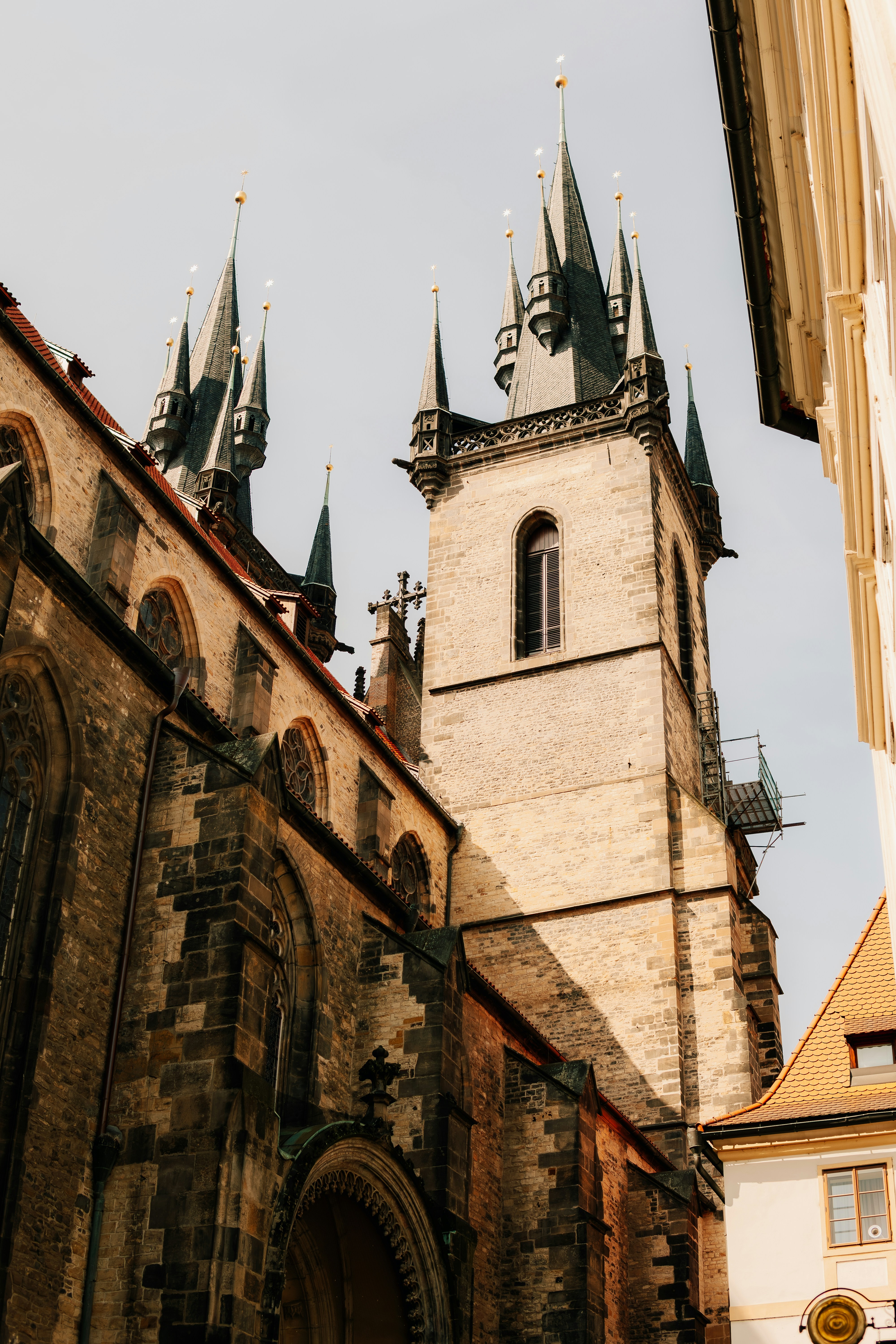 Spire and Stone: Gothic Towers Framing a Narrow City Street