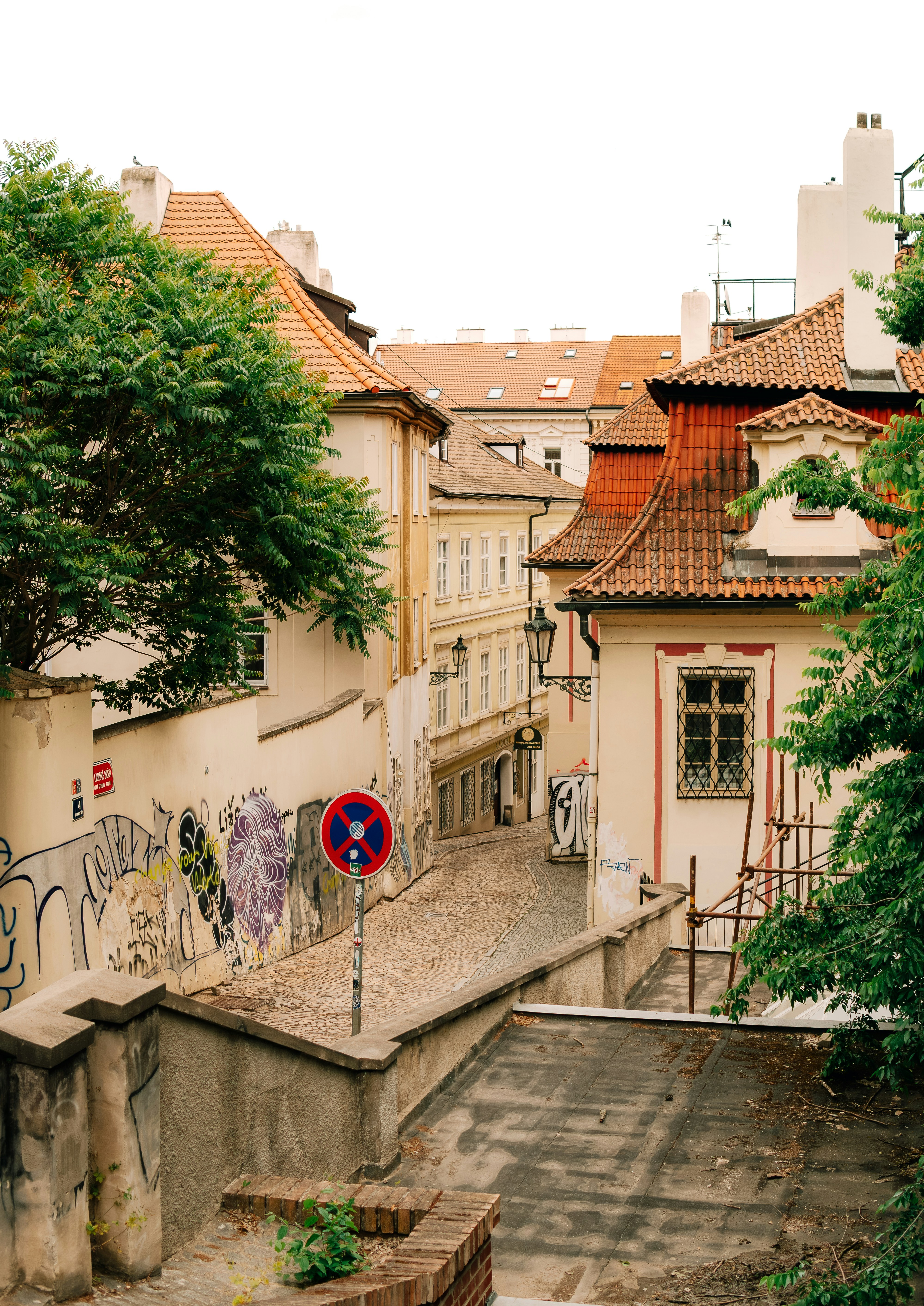 Quiet European Alley with Graffiti-Soaked Walls