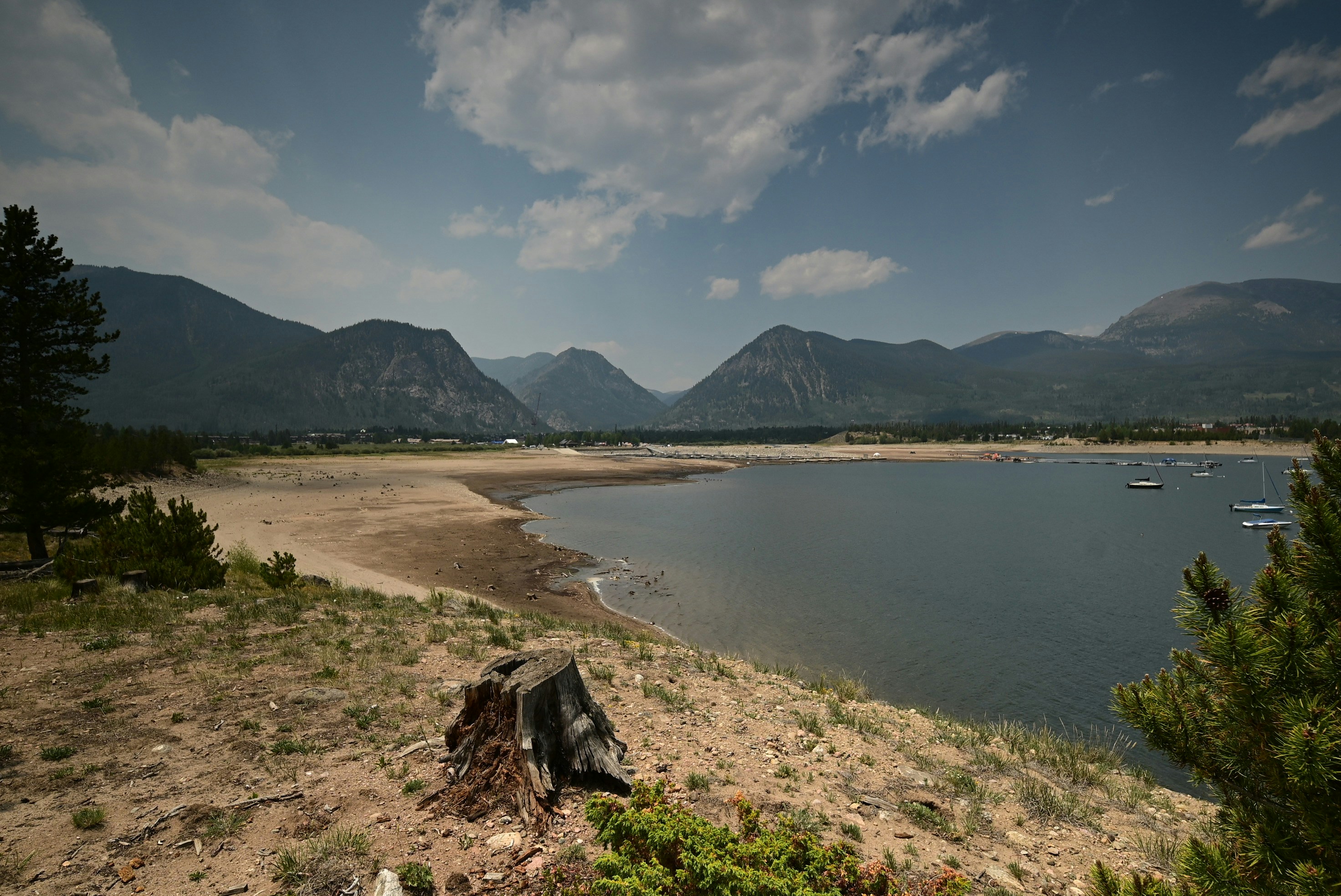 A Serene River Bend Surrounded by Distant Peaks
