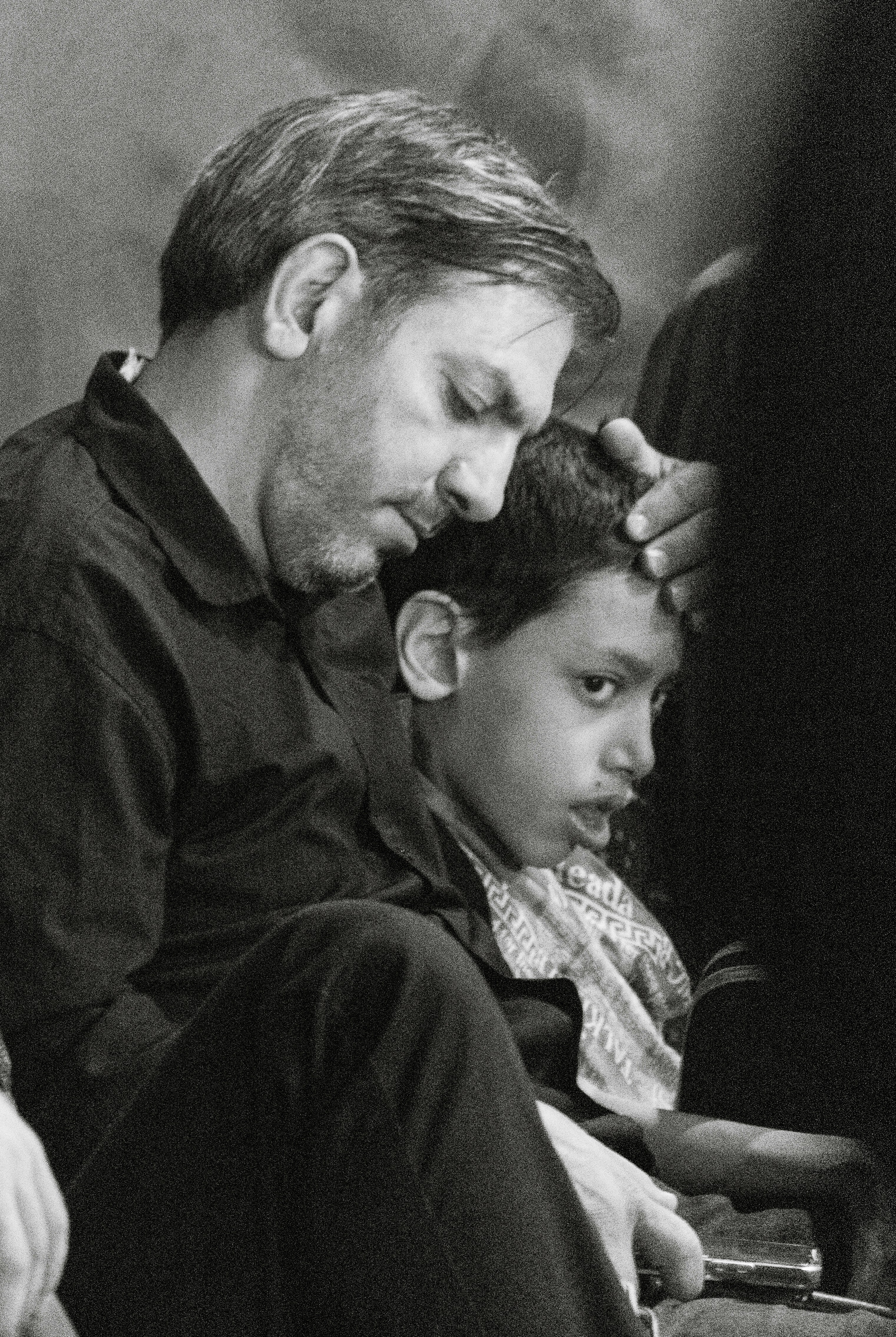 Quiet Bond: Father and Son Share a Moment in Soft Focus