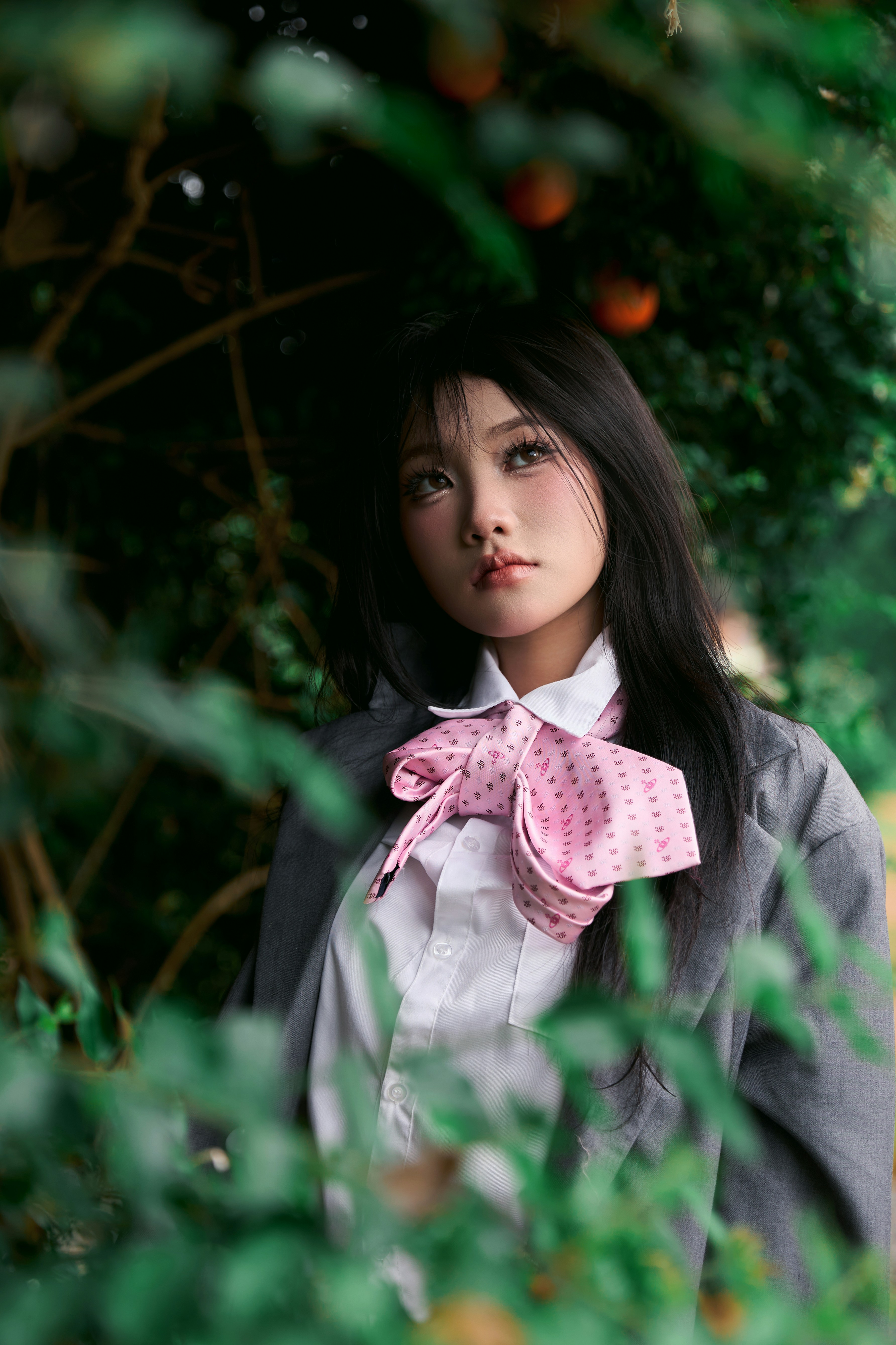 Soft Focus in the Orchard: Portrait Under Green Canopy