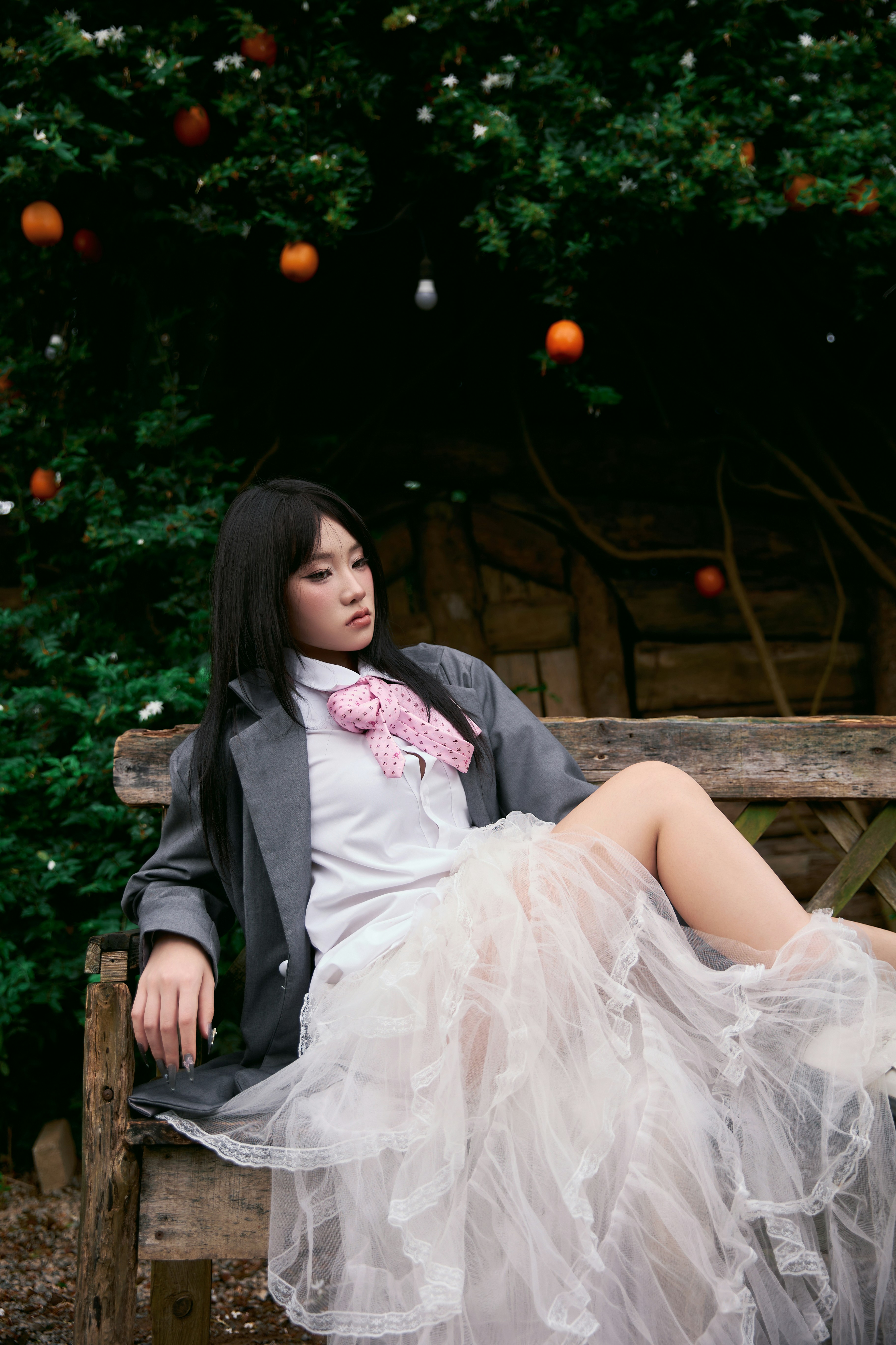 Portrait on the Orchard Bench: Velvet Coat, Tulle Skirt, and Olive Orchard Backdrop