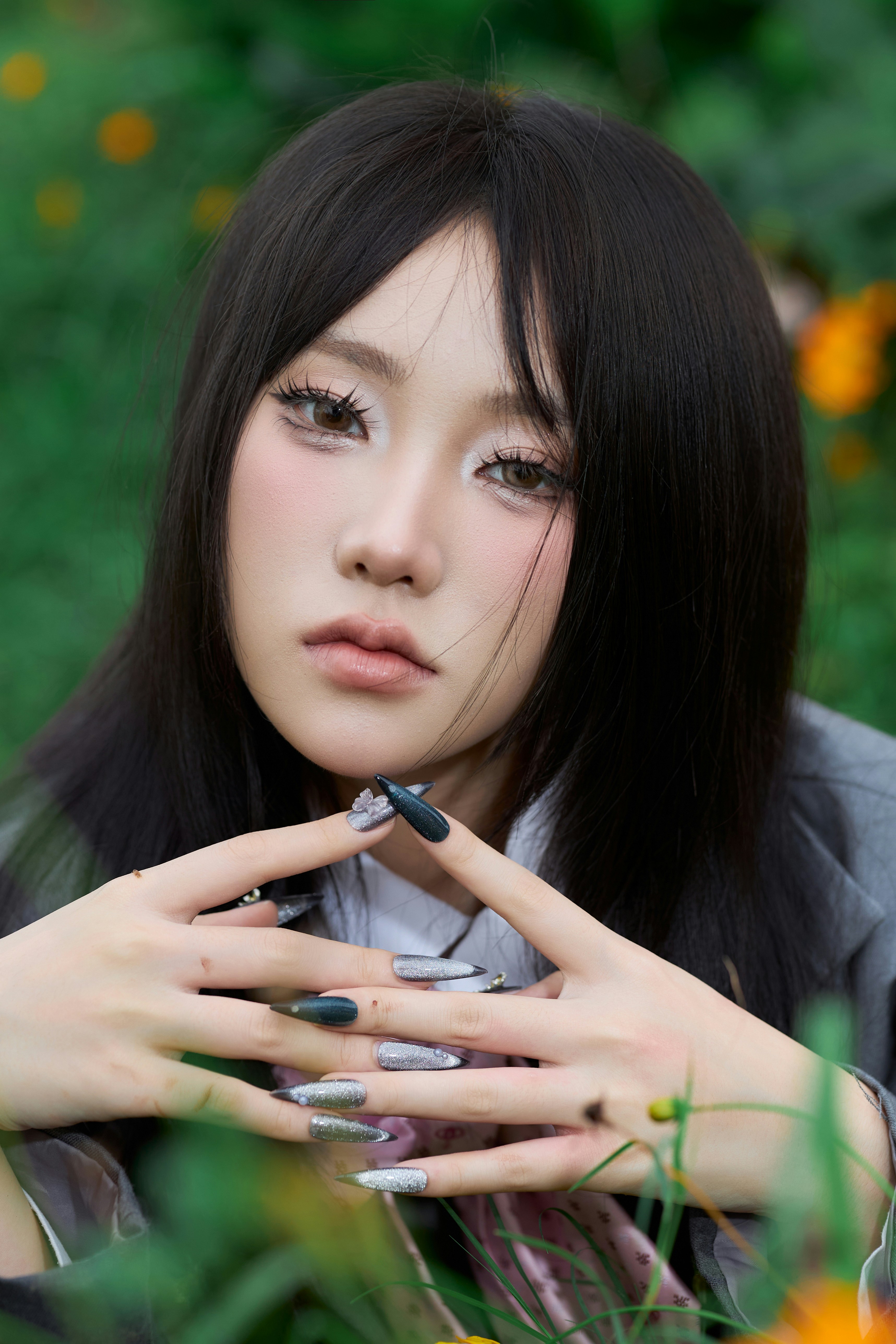 Eyes in the Garden: a close-up portrait with hands in soft focus