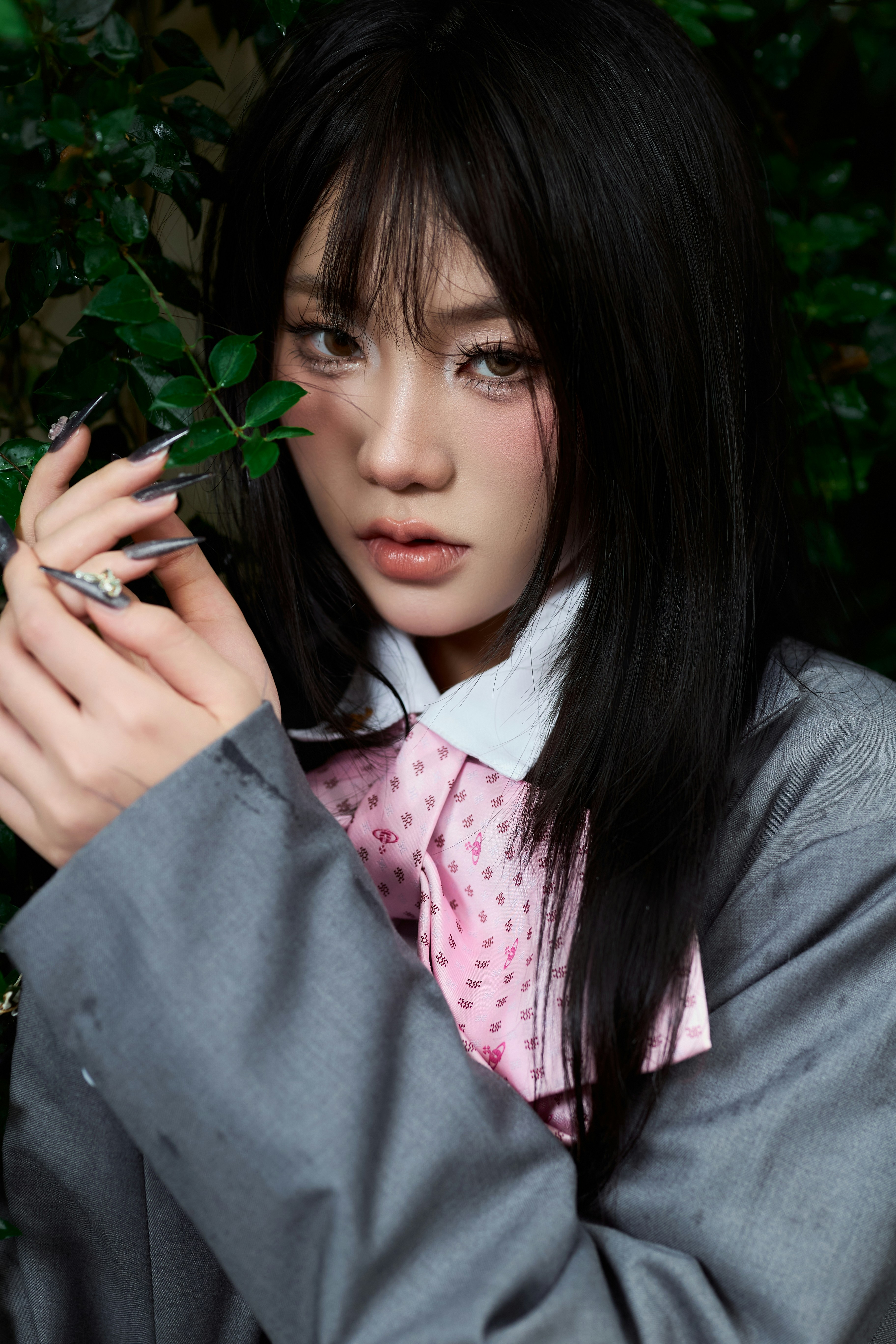 Veiled gaze among green tendrils