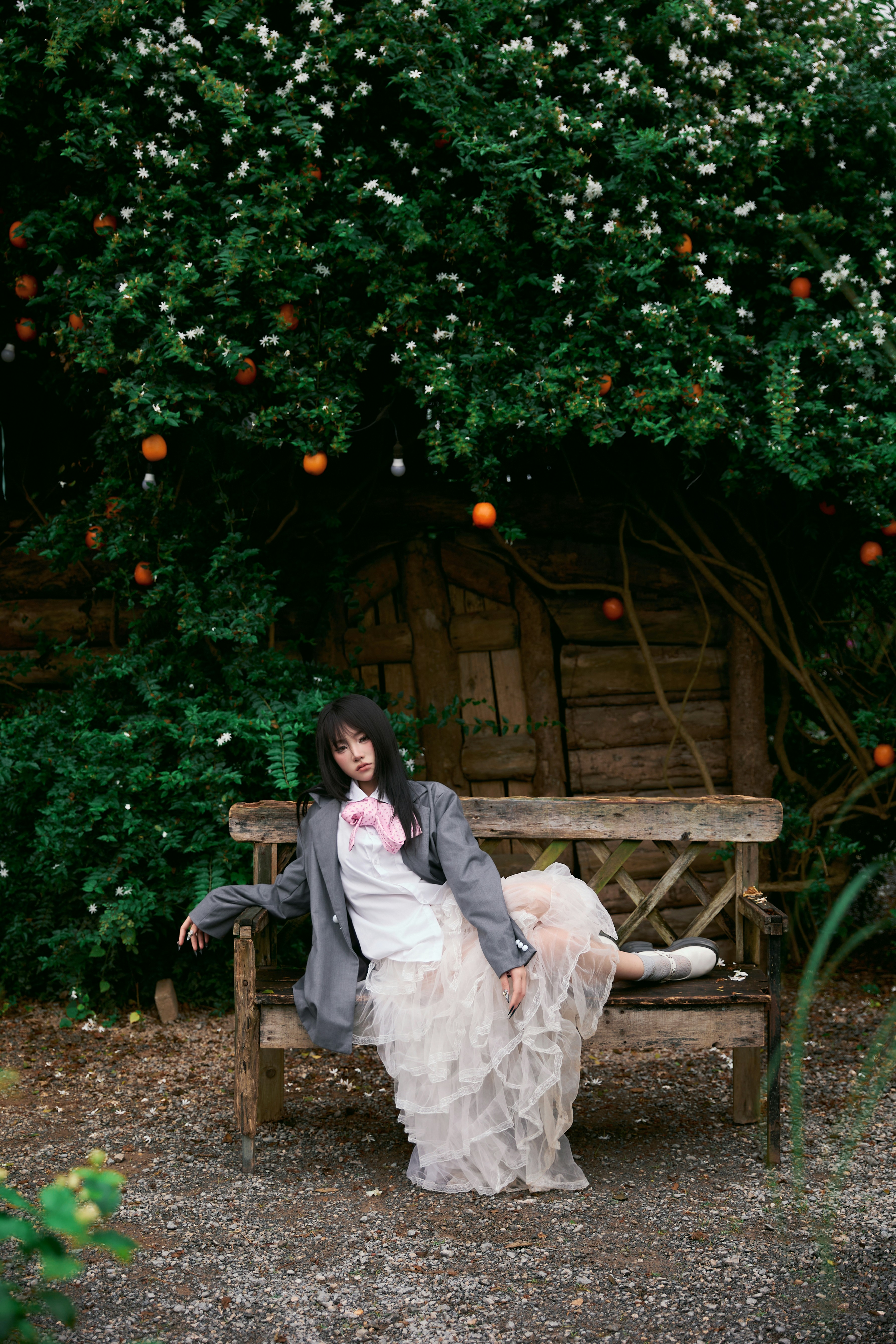 Portrait on a Garden Bench Beneath an Orange Tree Canopy