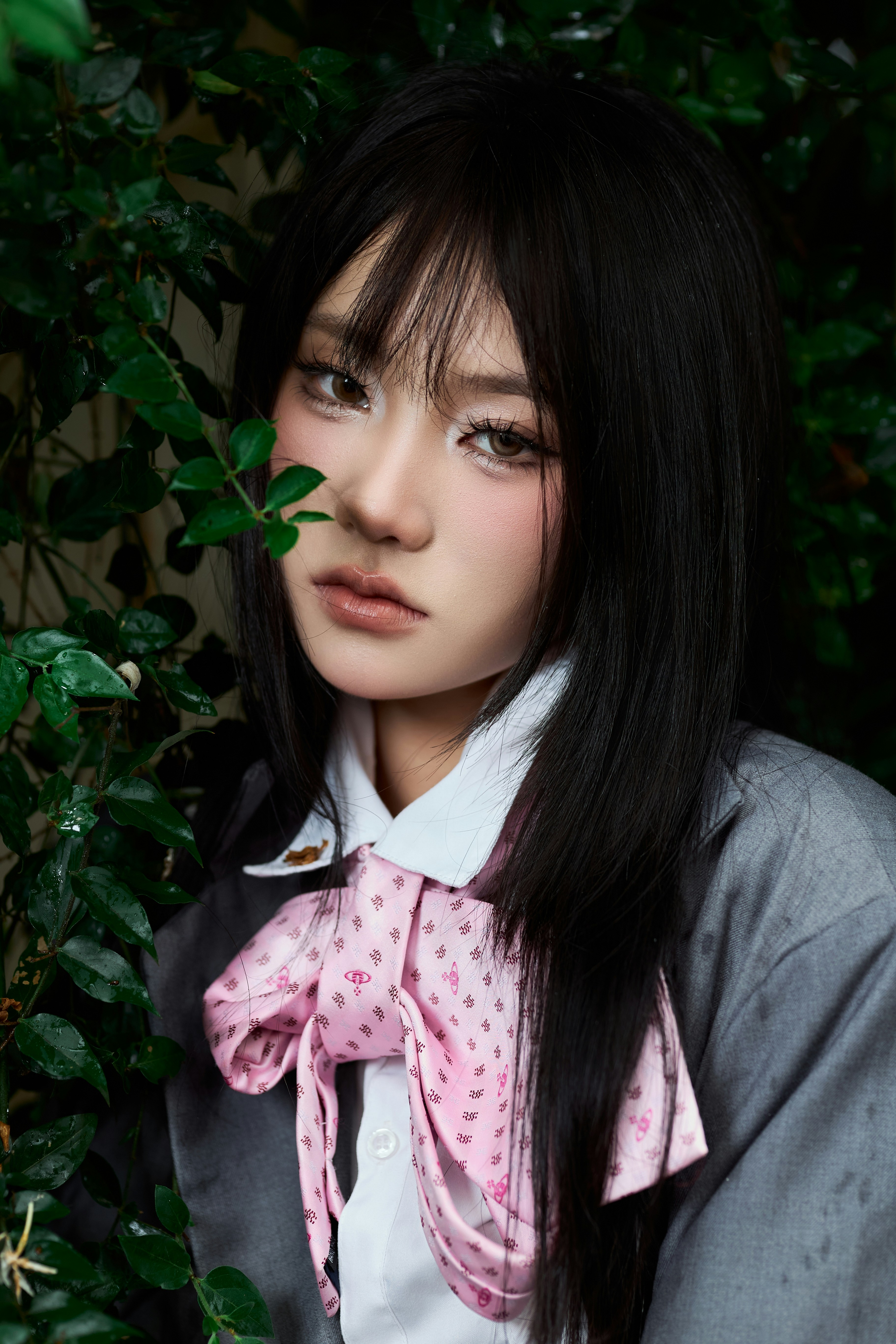 Veiled gaze among green tendrils