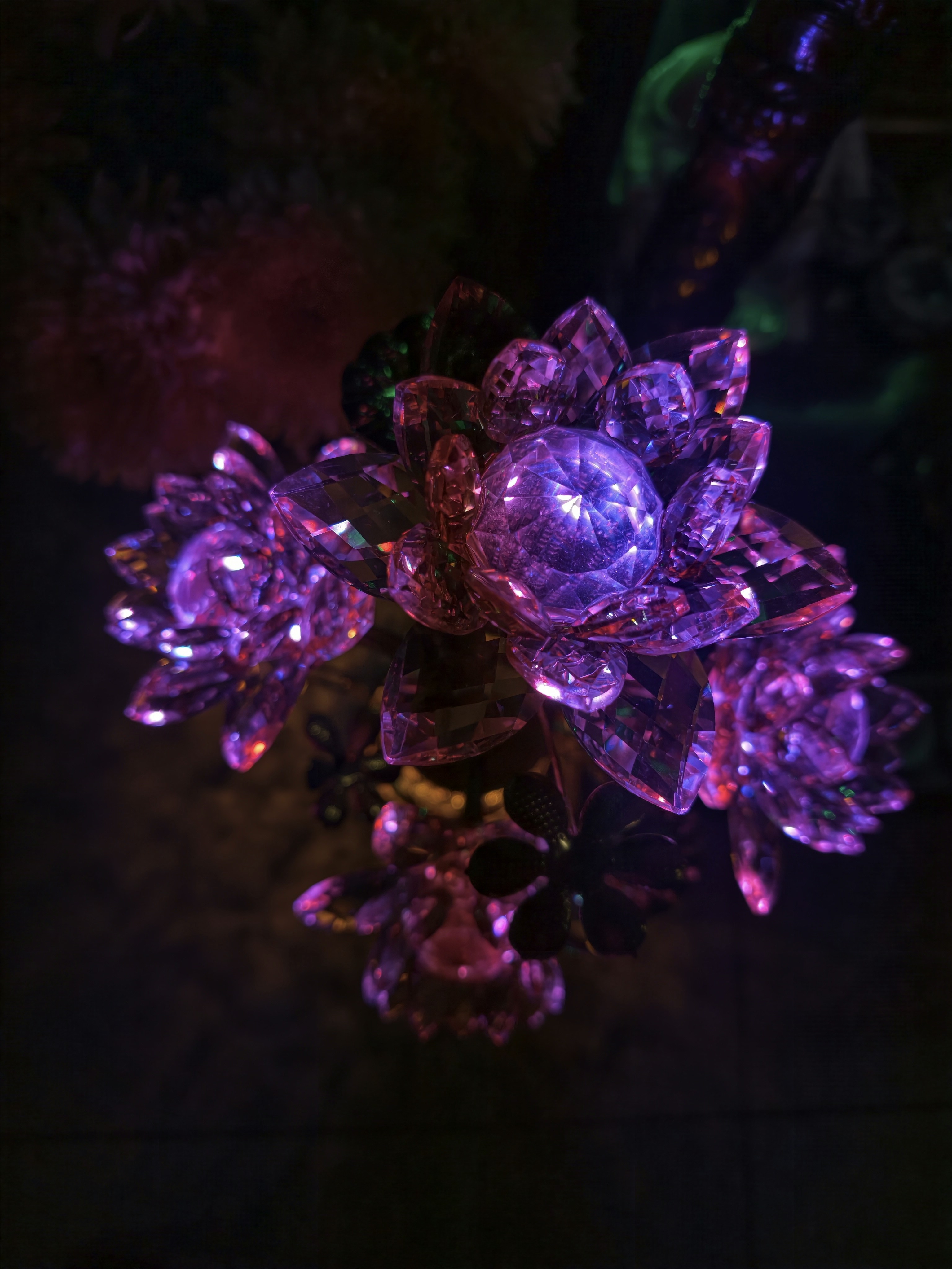 Lights changing, prayers staying the same. A crystal flower lamp at the altar.