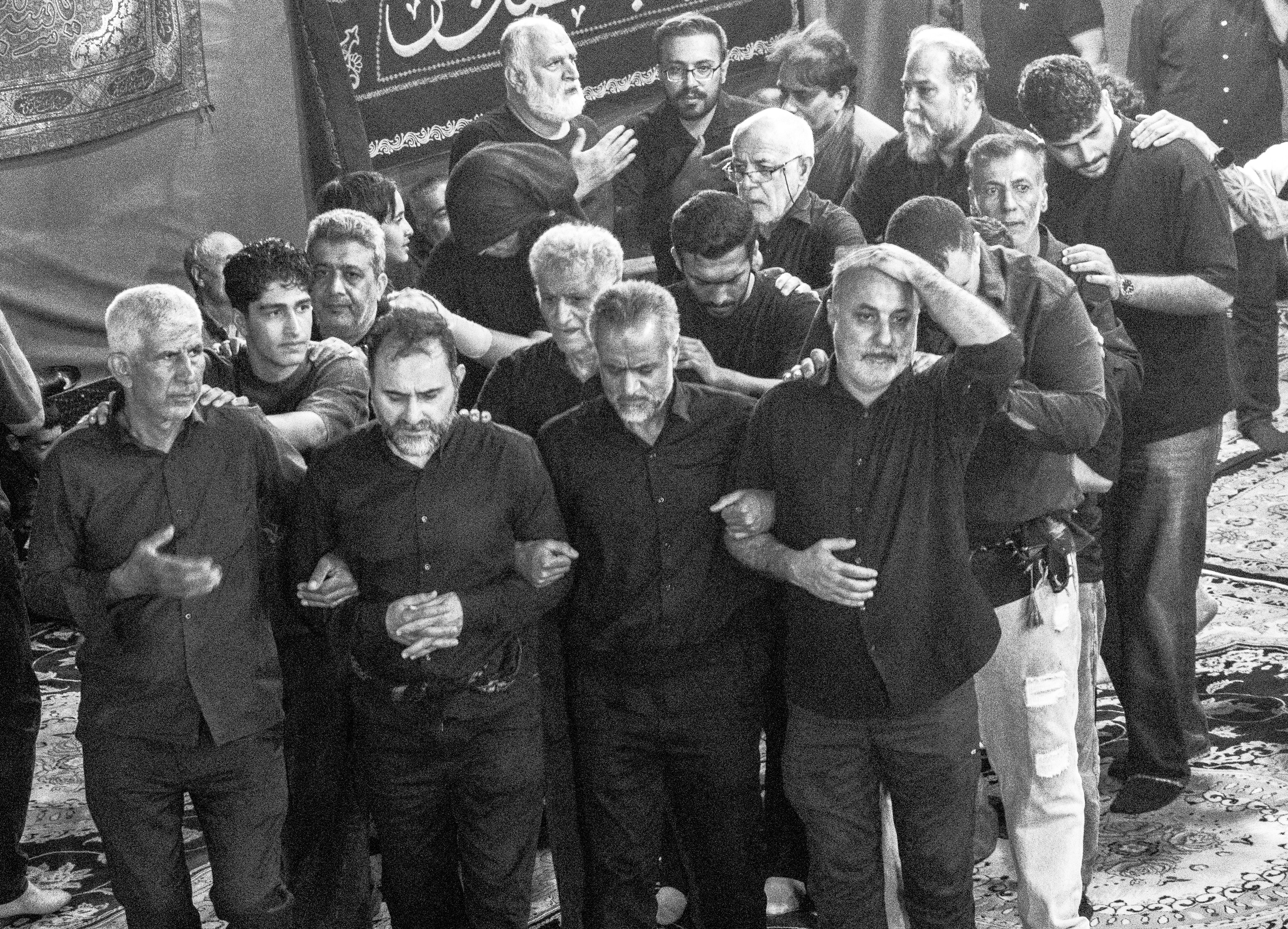 Concentrated Unity: A Line of Shared Resolve in a Quiet Gathering