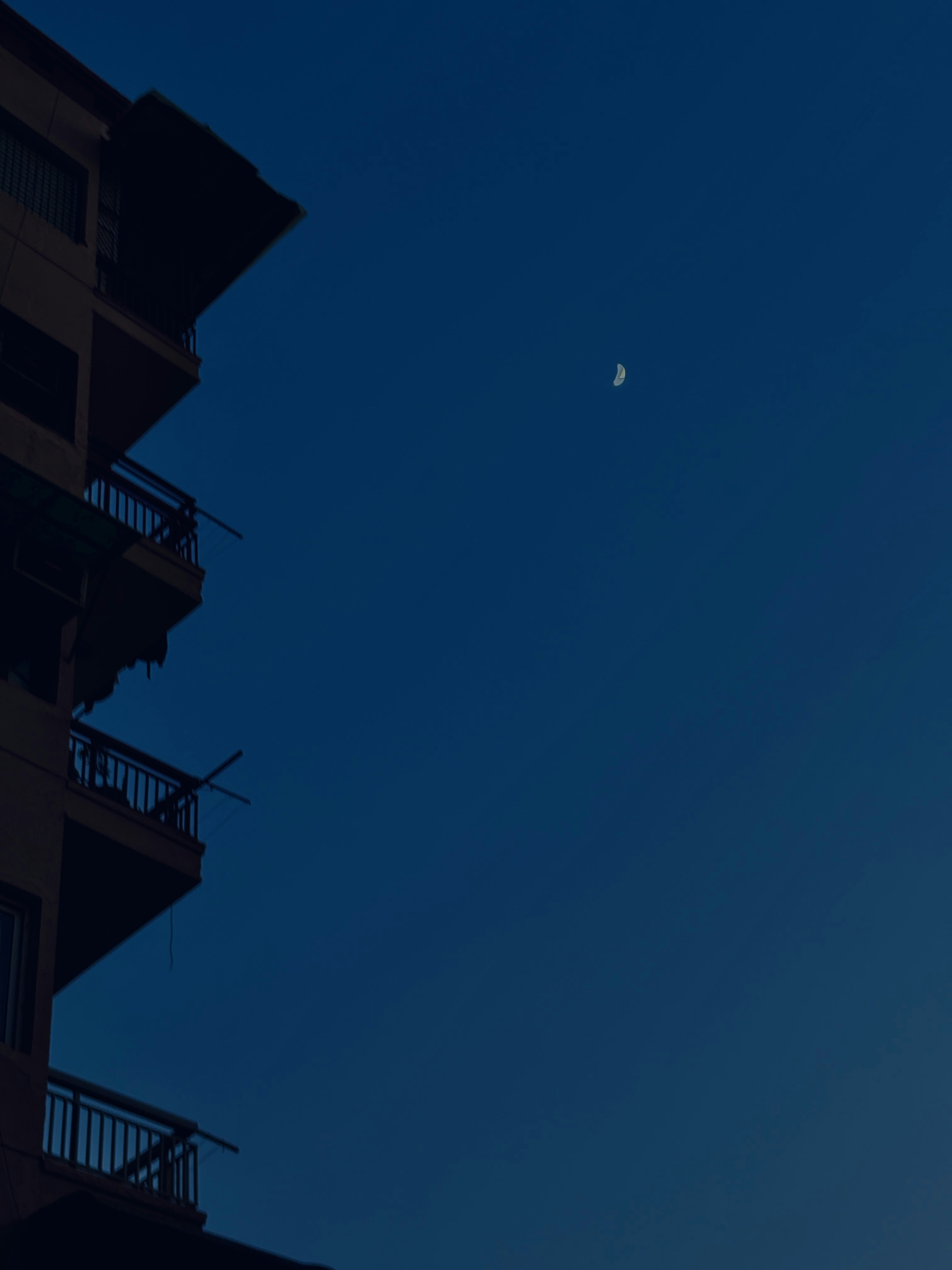 Moonlit Terrace: A Quiet Slice of Urban Sky