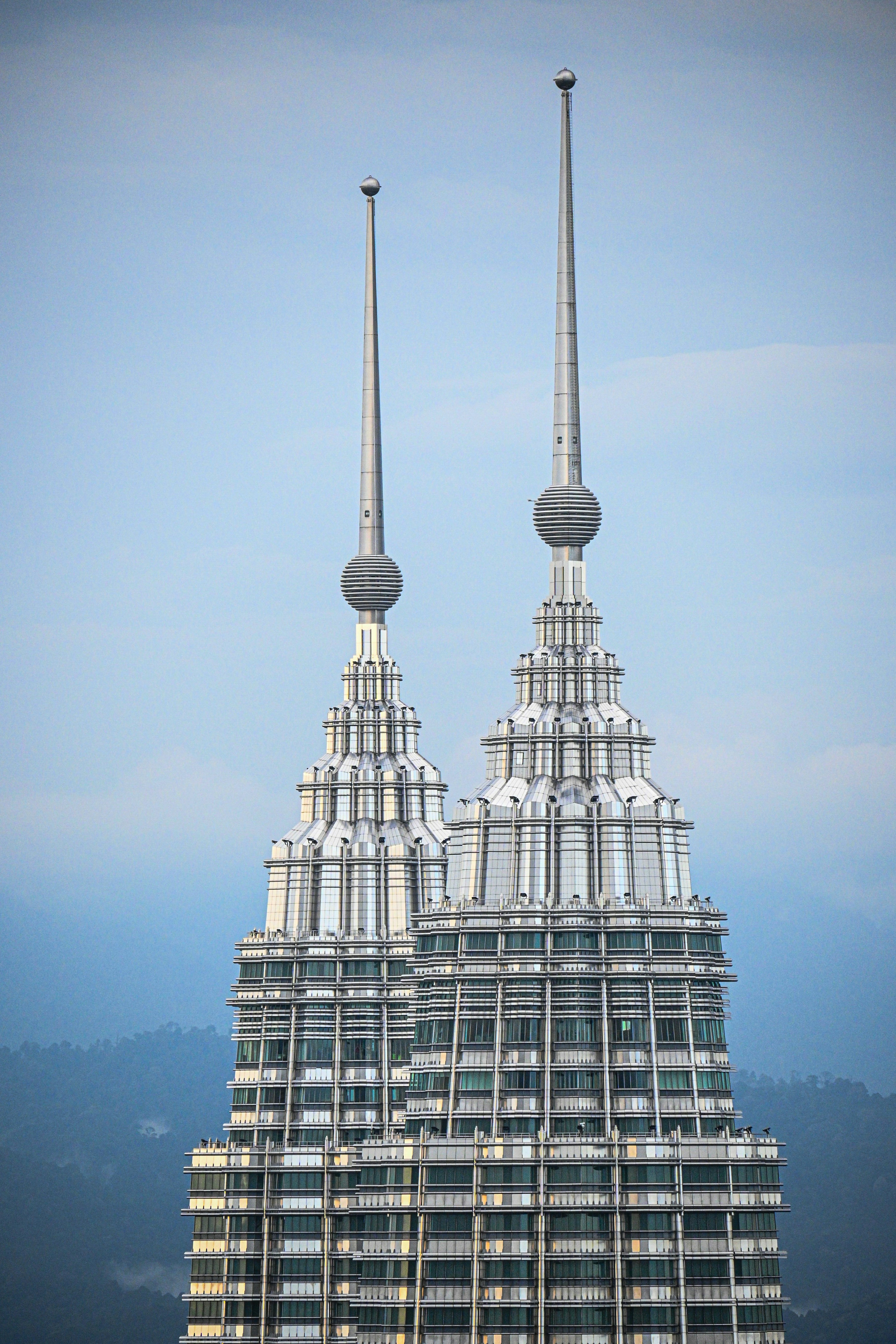 Close-up of the exterior facade of the Petronas Twin Towers.