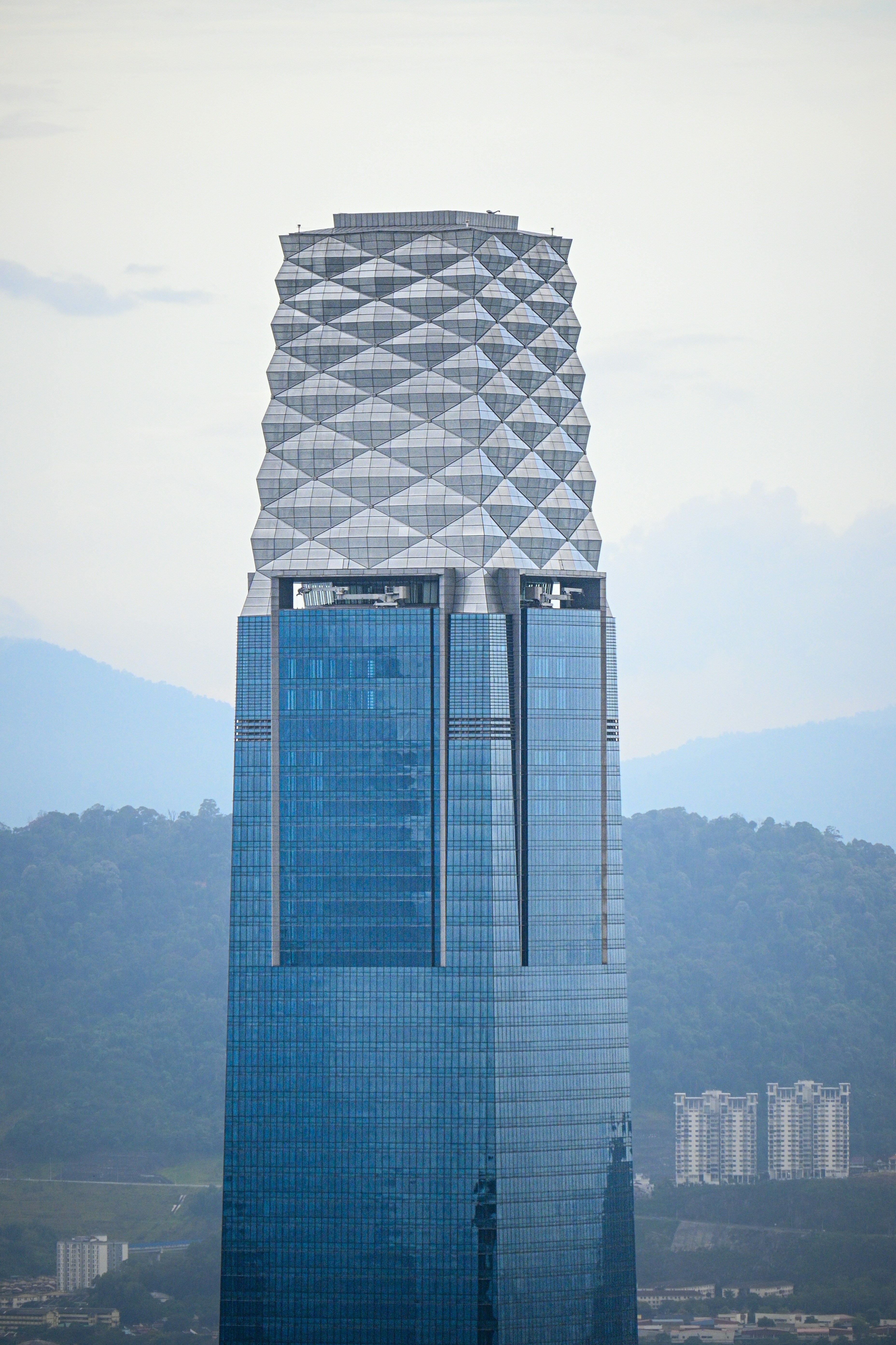 Capped Skyline: Geometric Tower Reaches the Sky