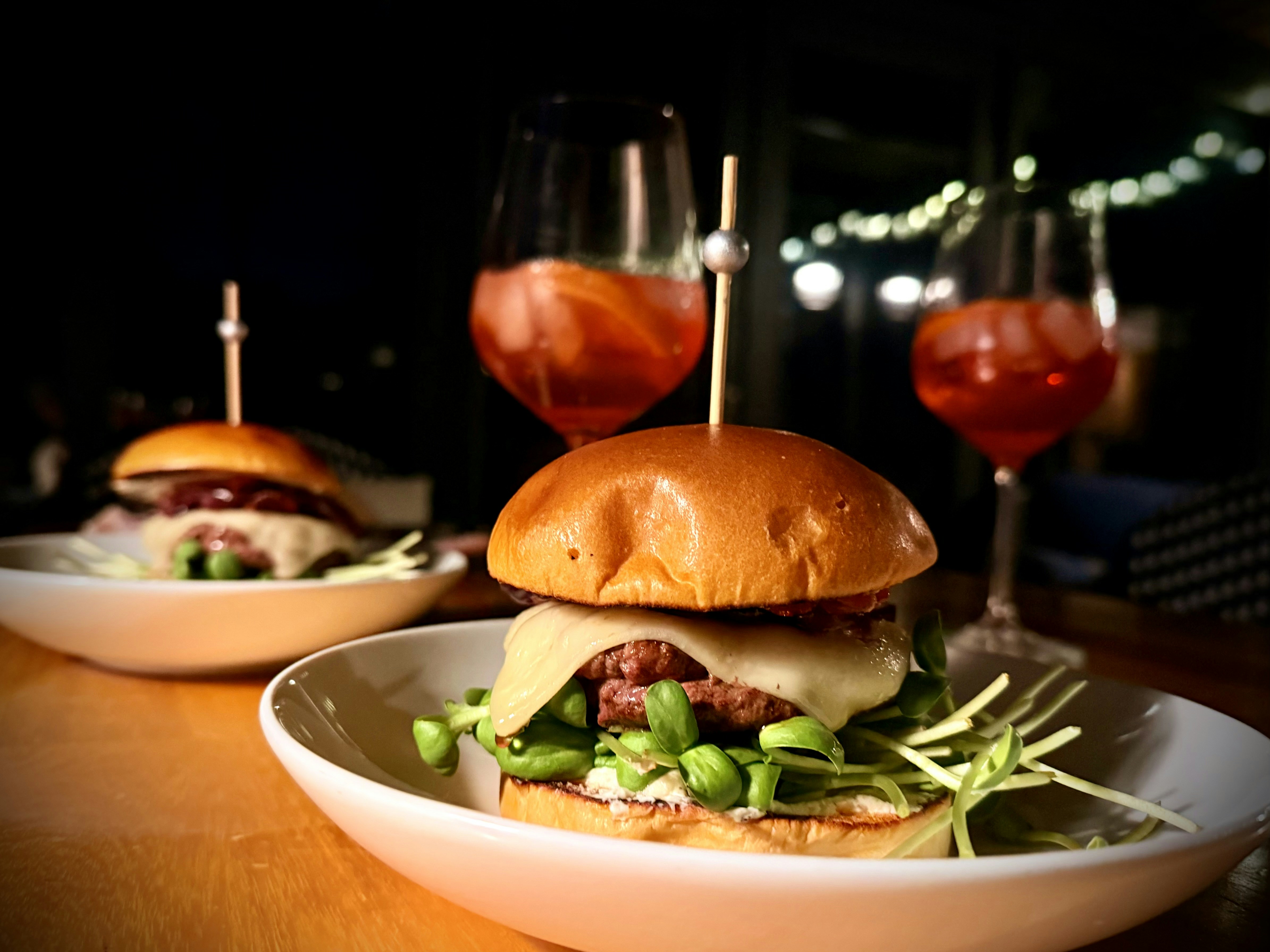 Midnight Grill: A Cheeseburger Spotlight with Glazed Garnish