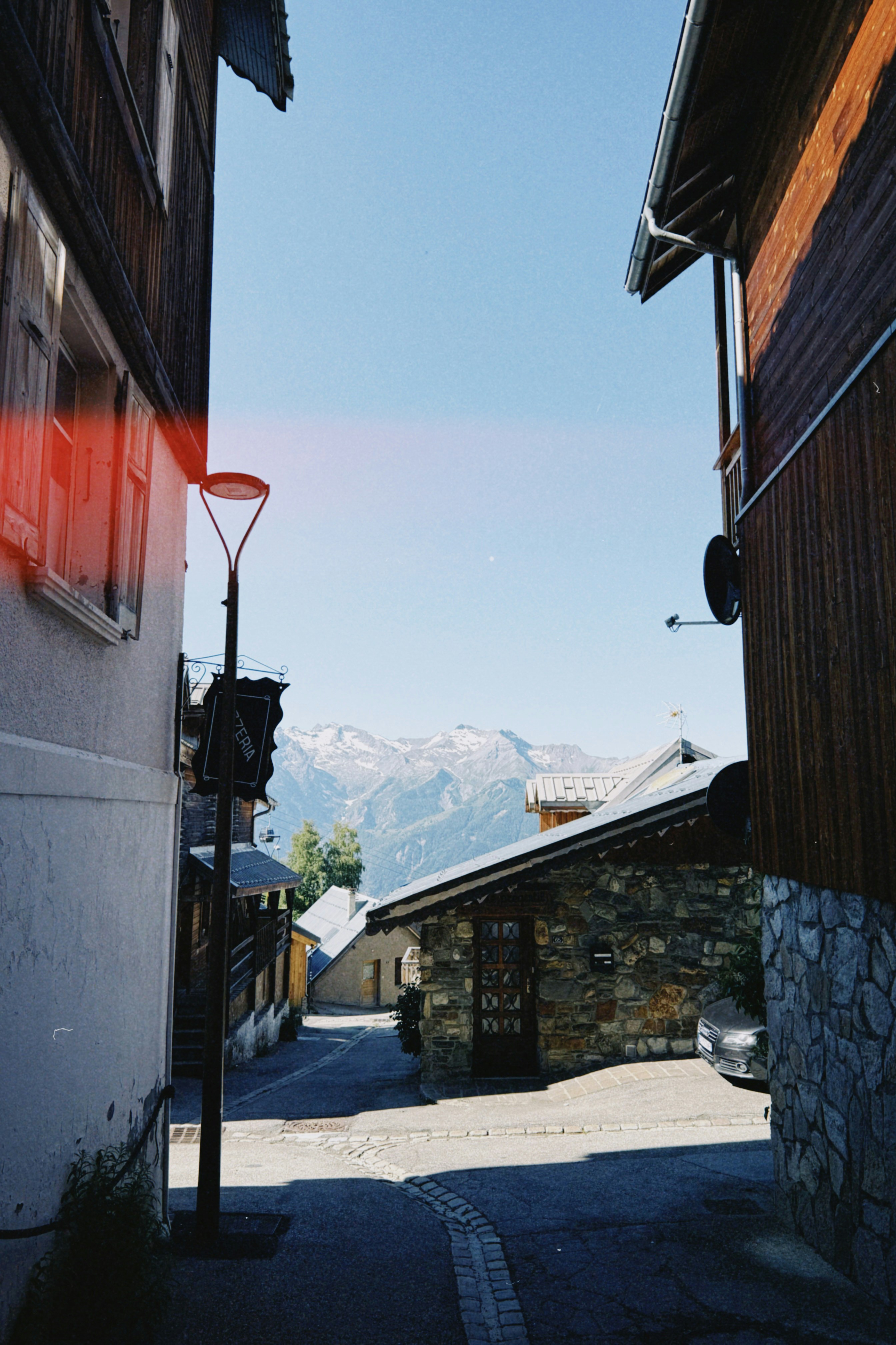 A Mountain Village Alley Framed by Timbered Facades