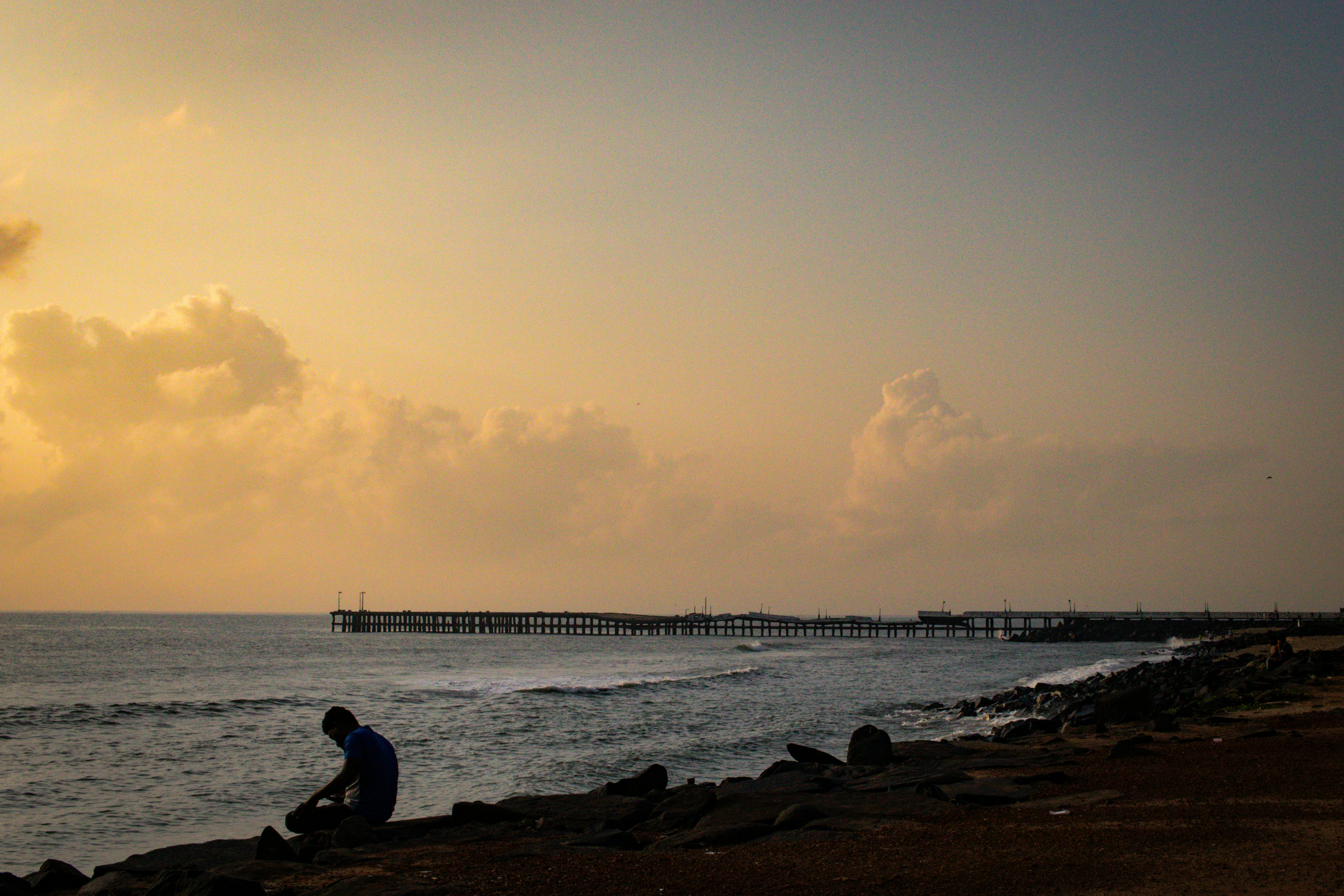 Sunset Silhouette: A Loner on the Shore