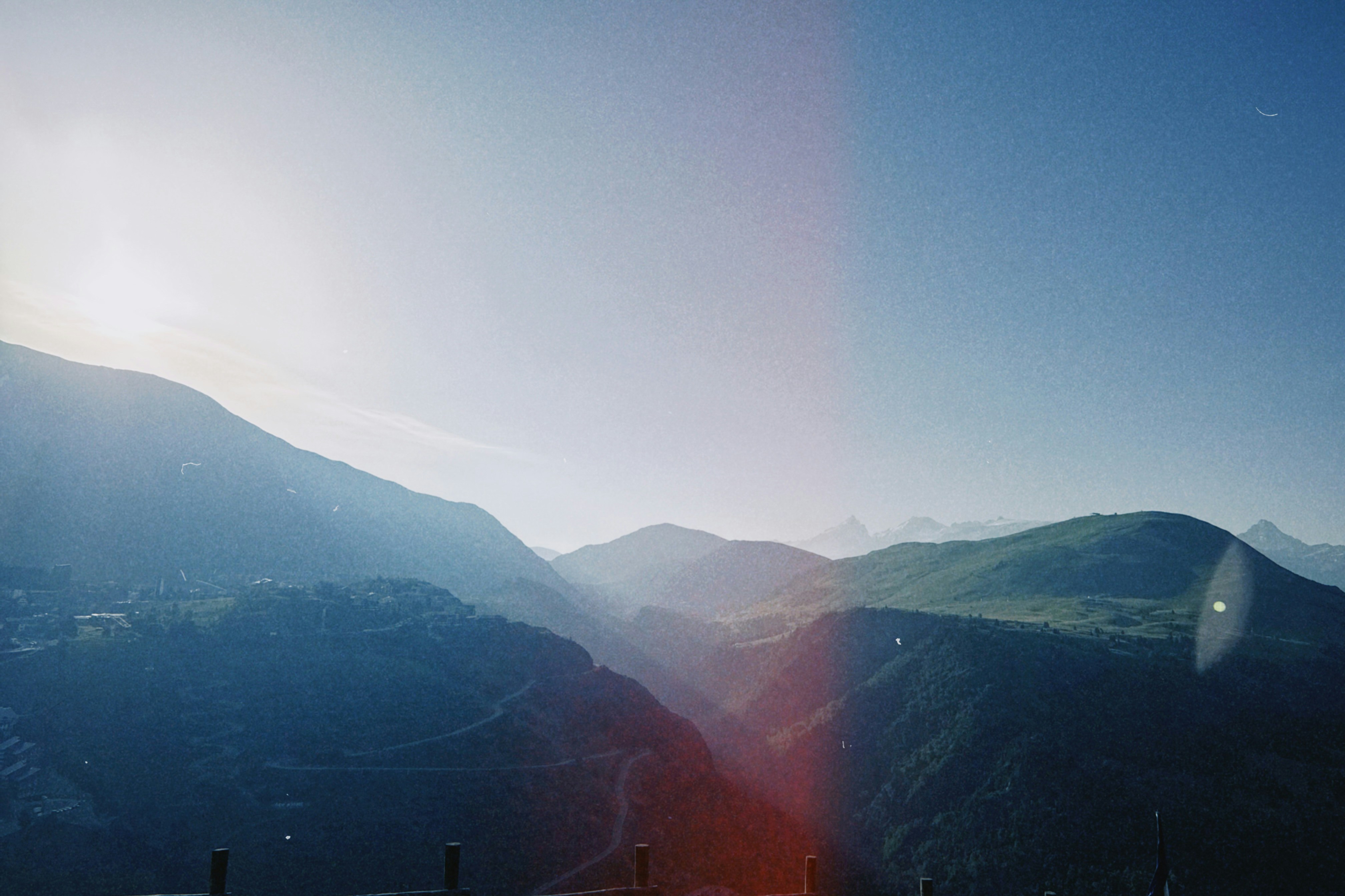  Valley Light: Mountain Range with Gentle Haze and Sun Glare