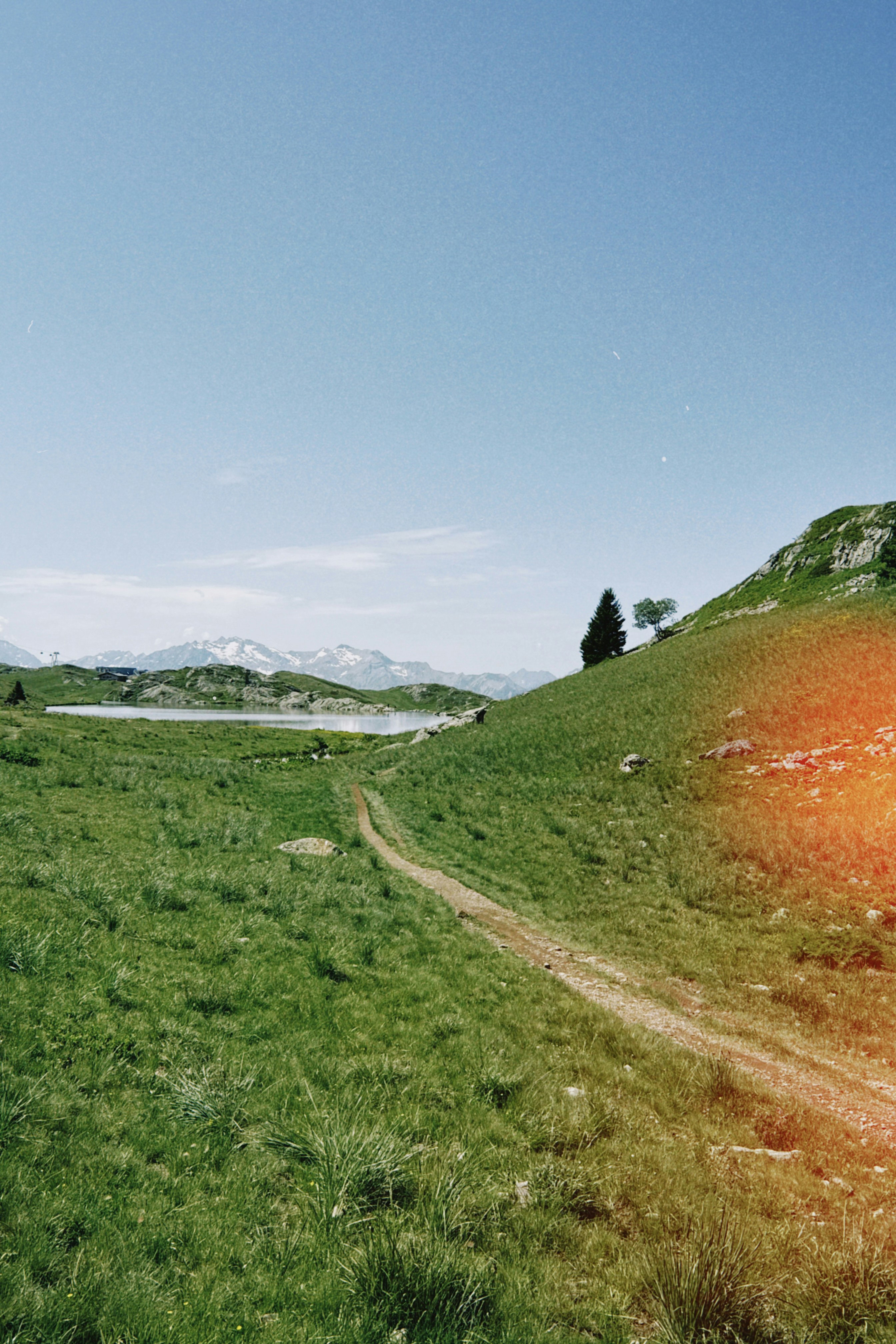 Trail to the Distant Summit Under a Clear Alpine Sky