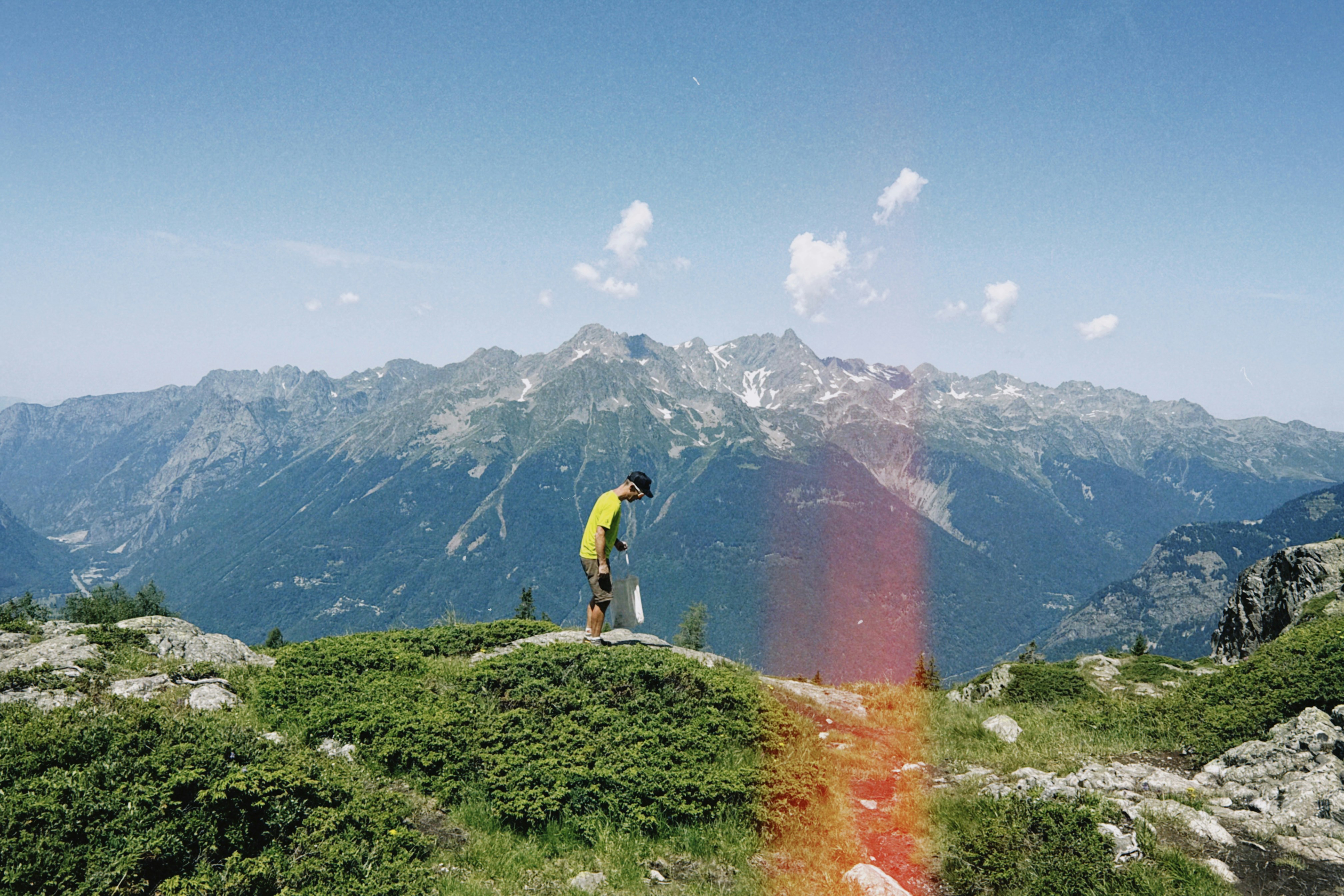 Hiker in a Luminous Alpine Meadow