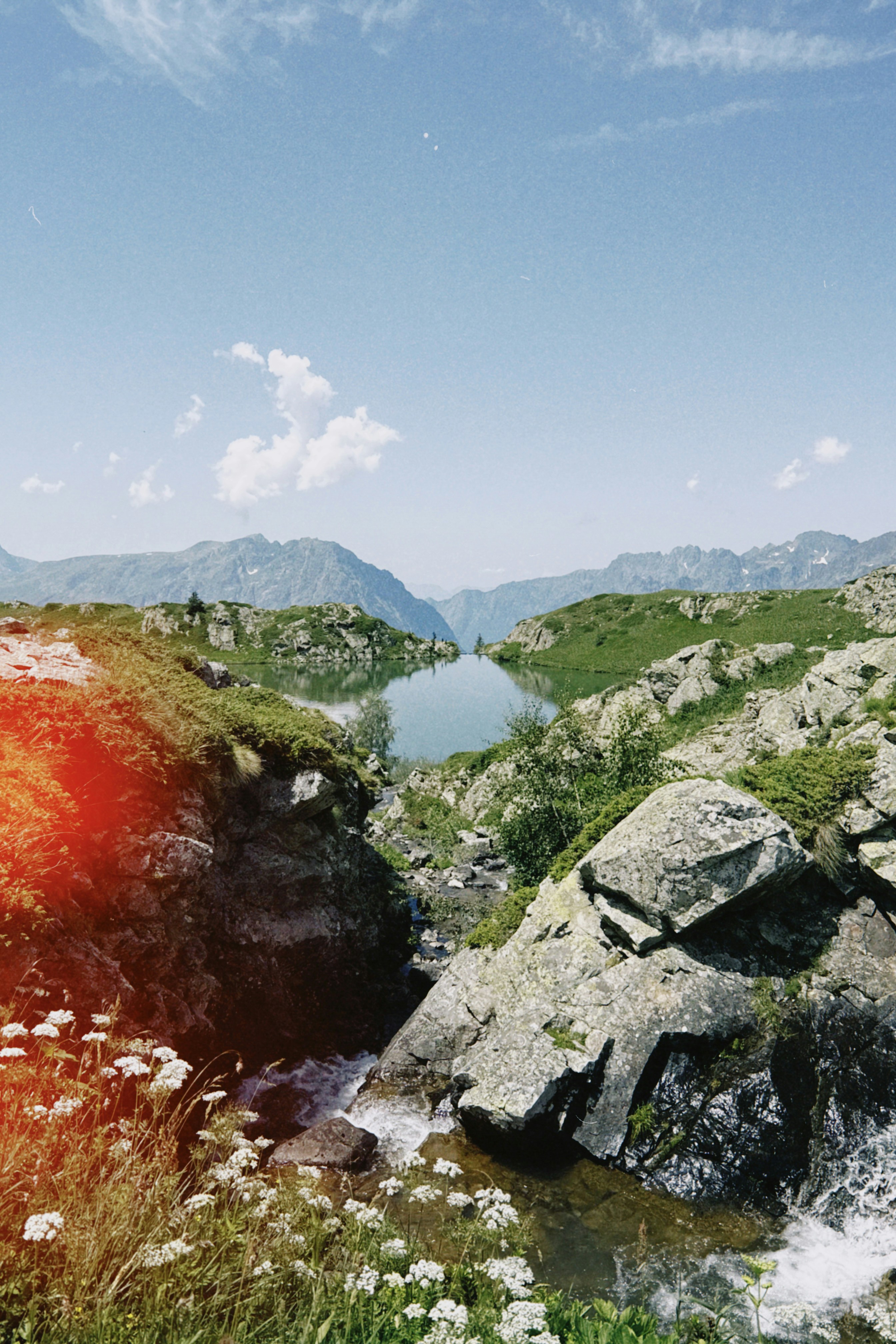Crystal Gate: Mountain Lake Amid Rugged Foreground