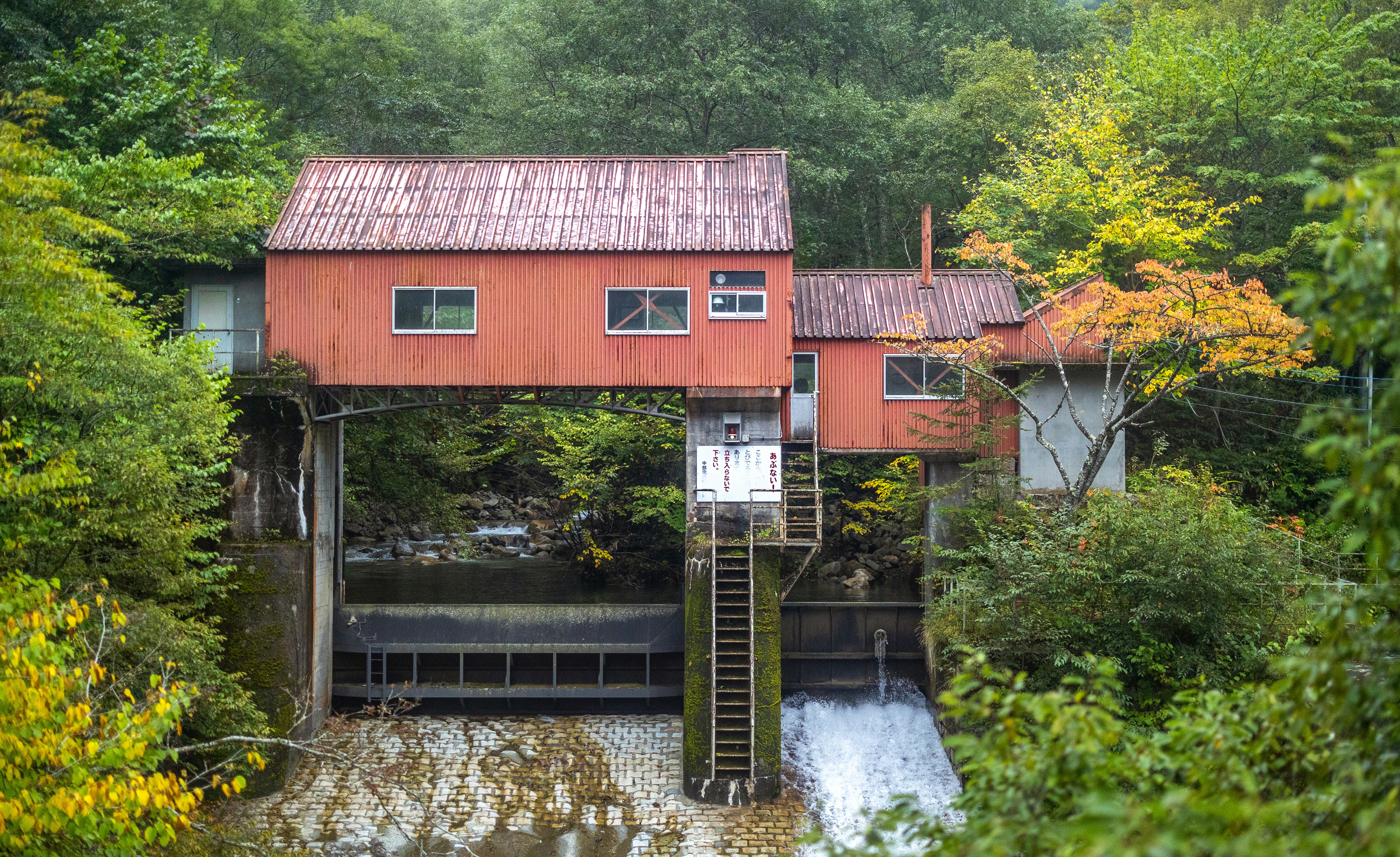 Bridge-ward Hydroelectric Mill: A Rust-Colored Workshop Over the Cascading Weir