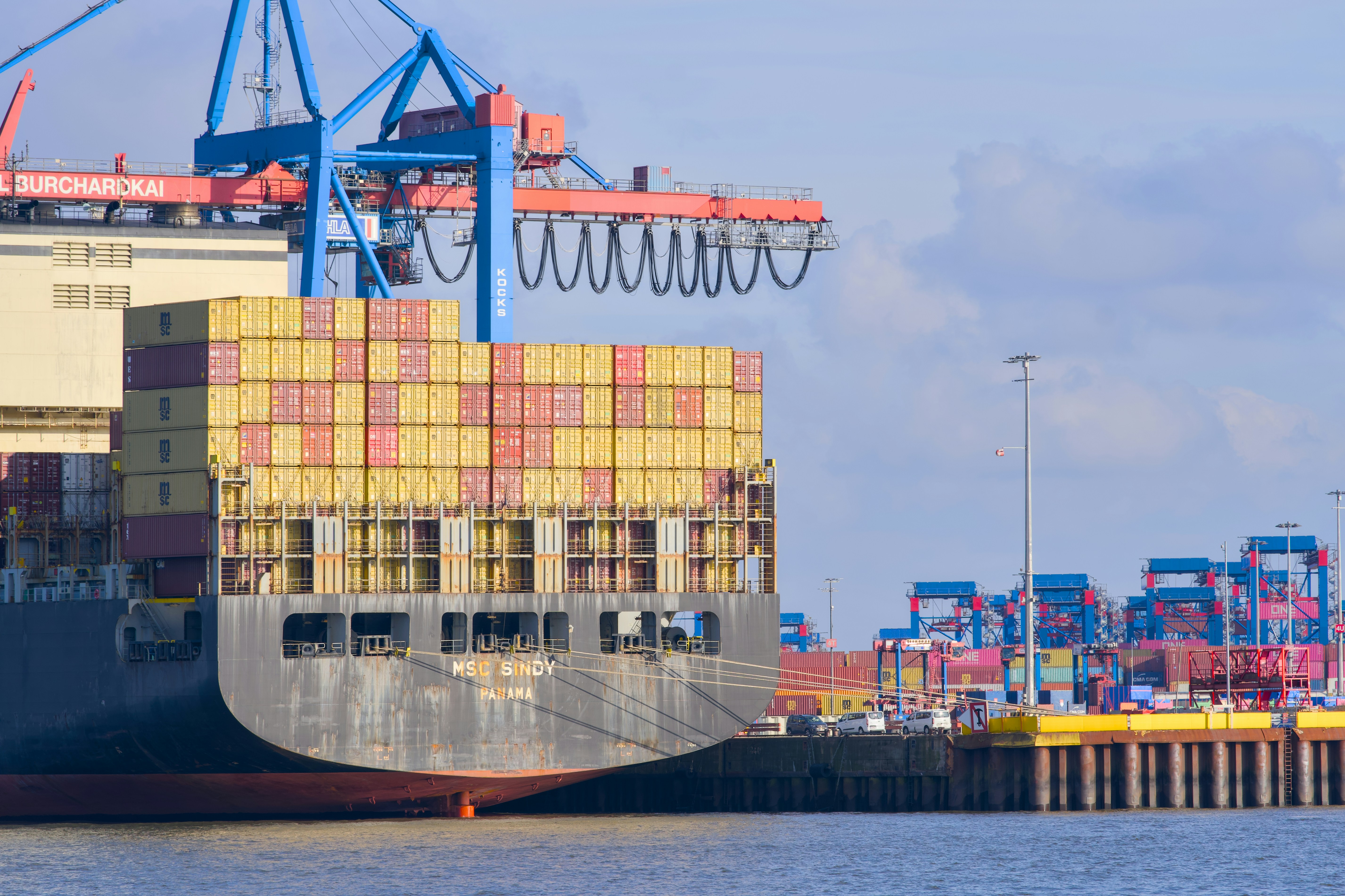 Container Ship at the Horizon: Geometric Cargo in Red and Yellow