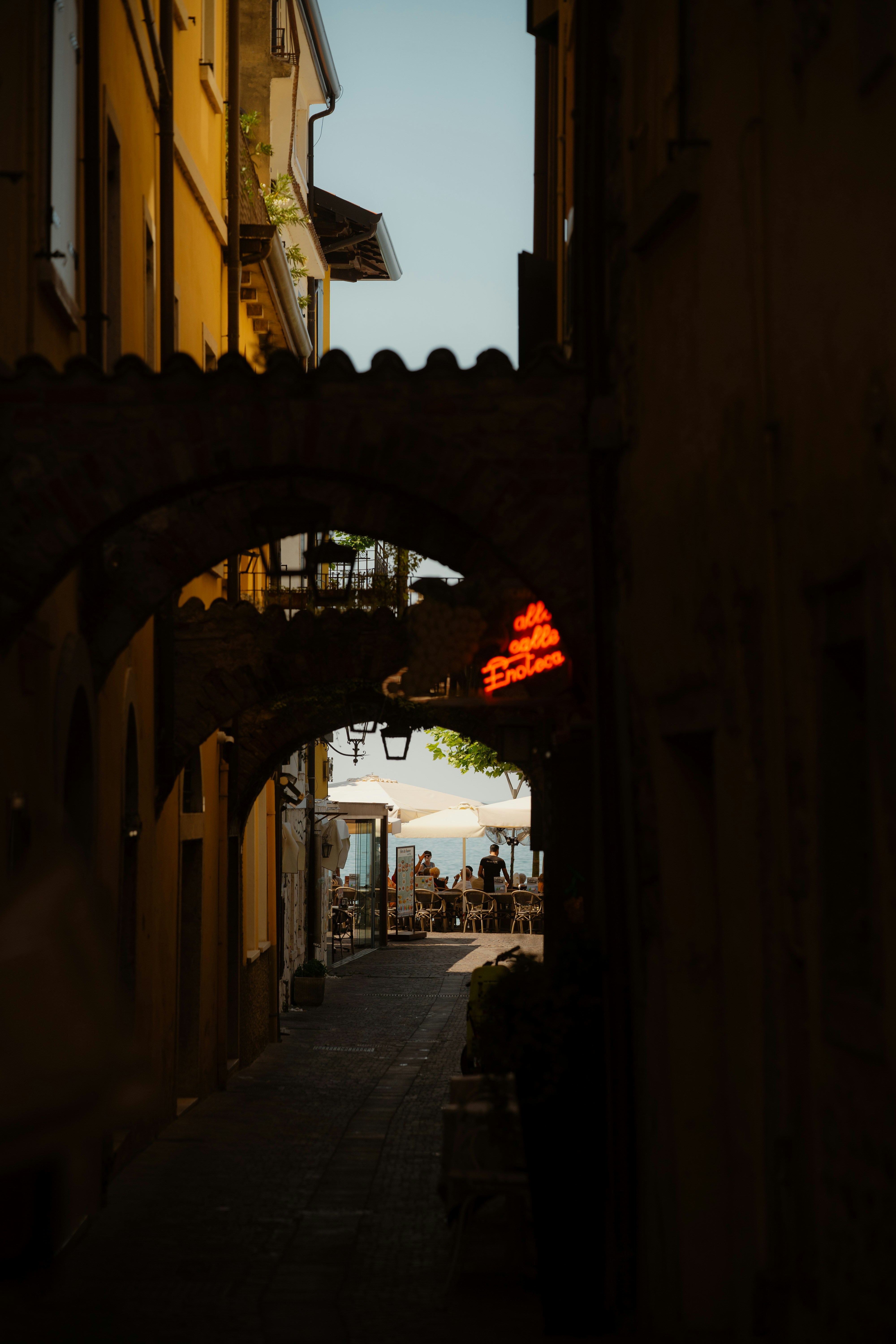 Archway Corridor to Sunlit Café