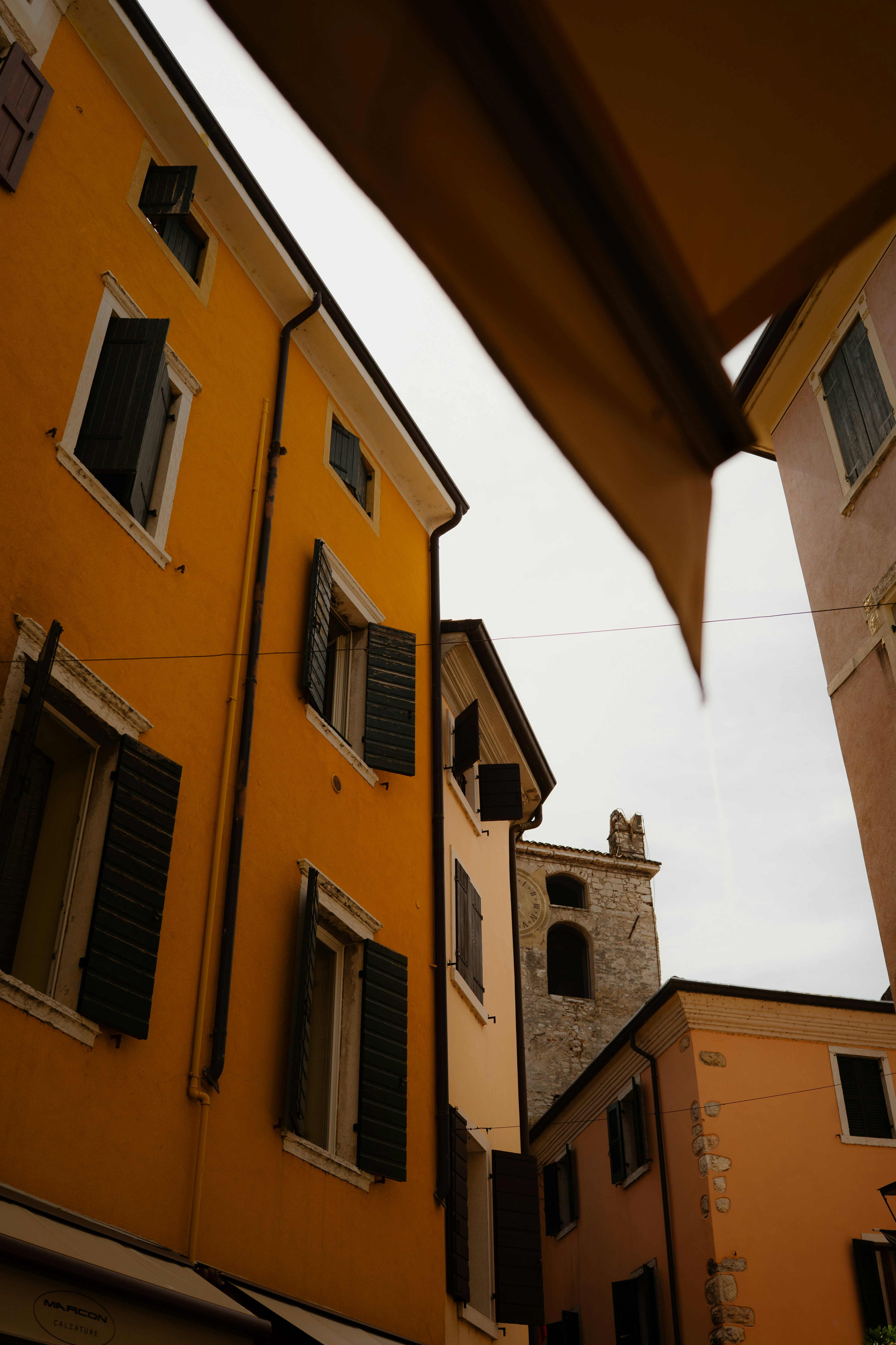 Golden European Calle Scene Framed by Overhanging Umbra