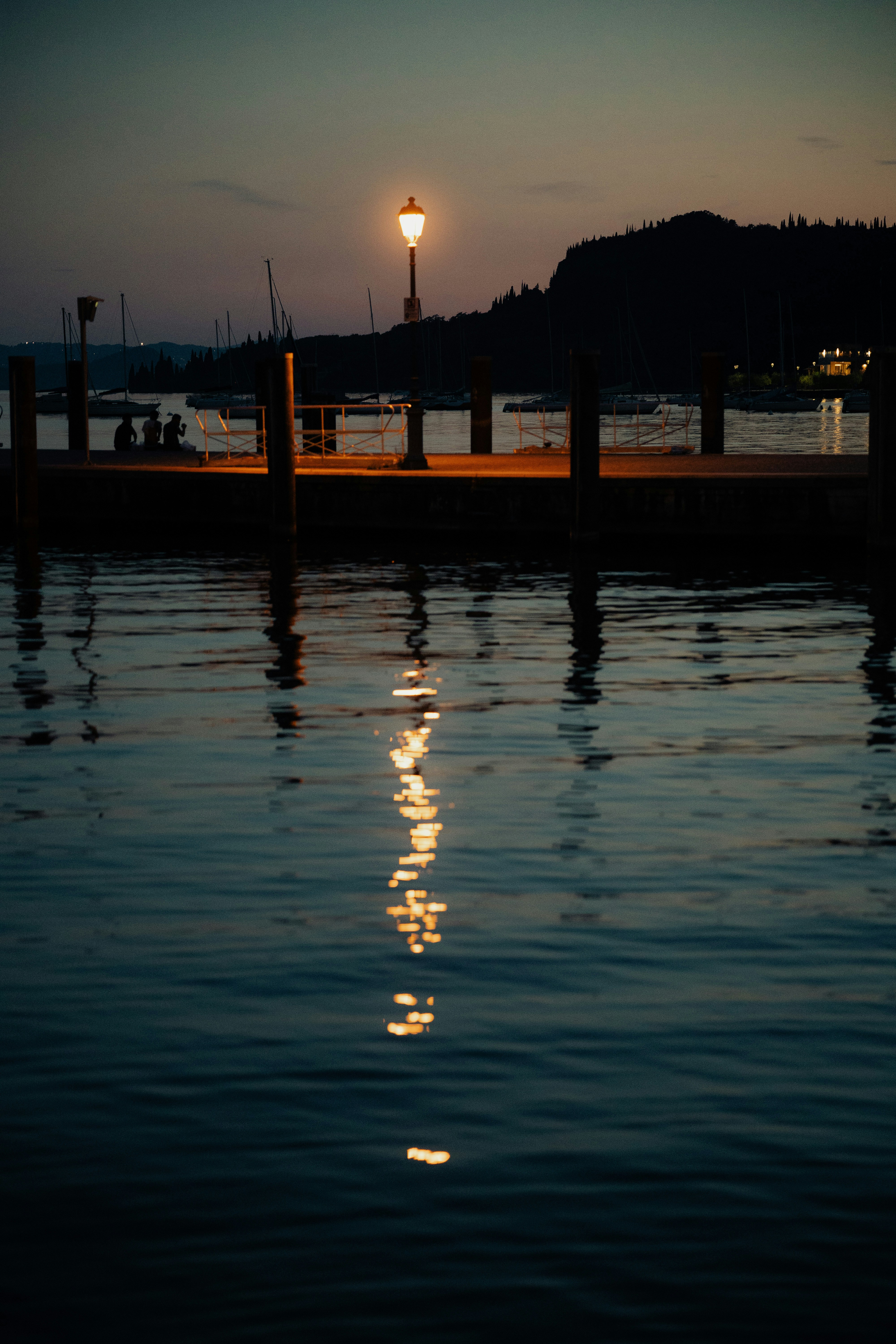 Evening Lantern Over the Quiet Pier