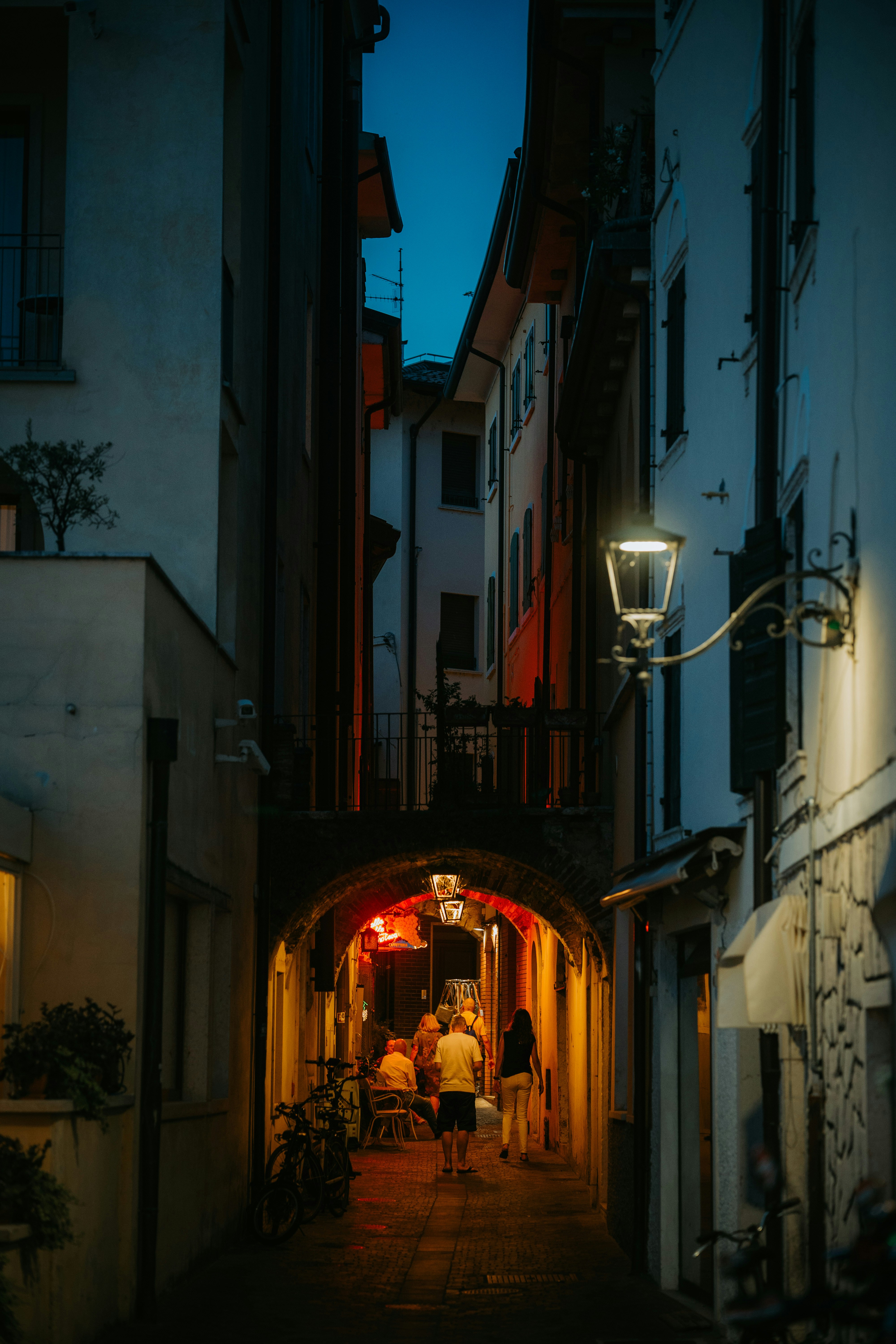 Twilight Alley Café: Lantern glow guiding footsteps under the arch