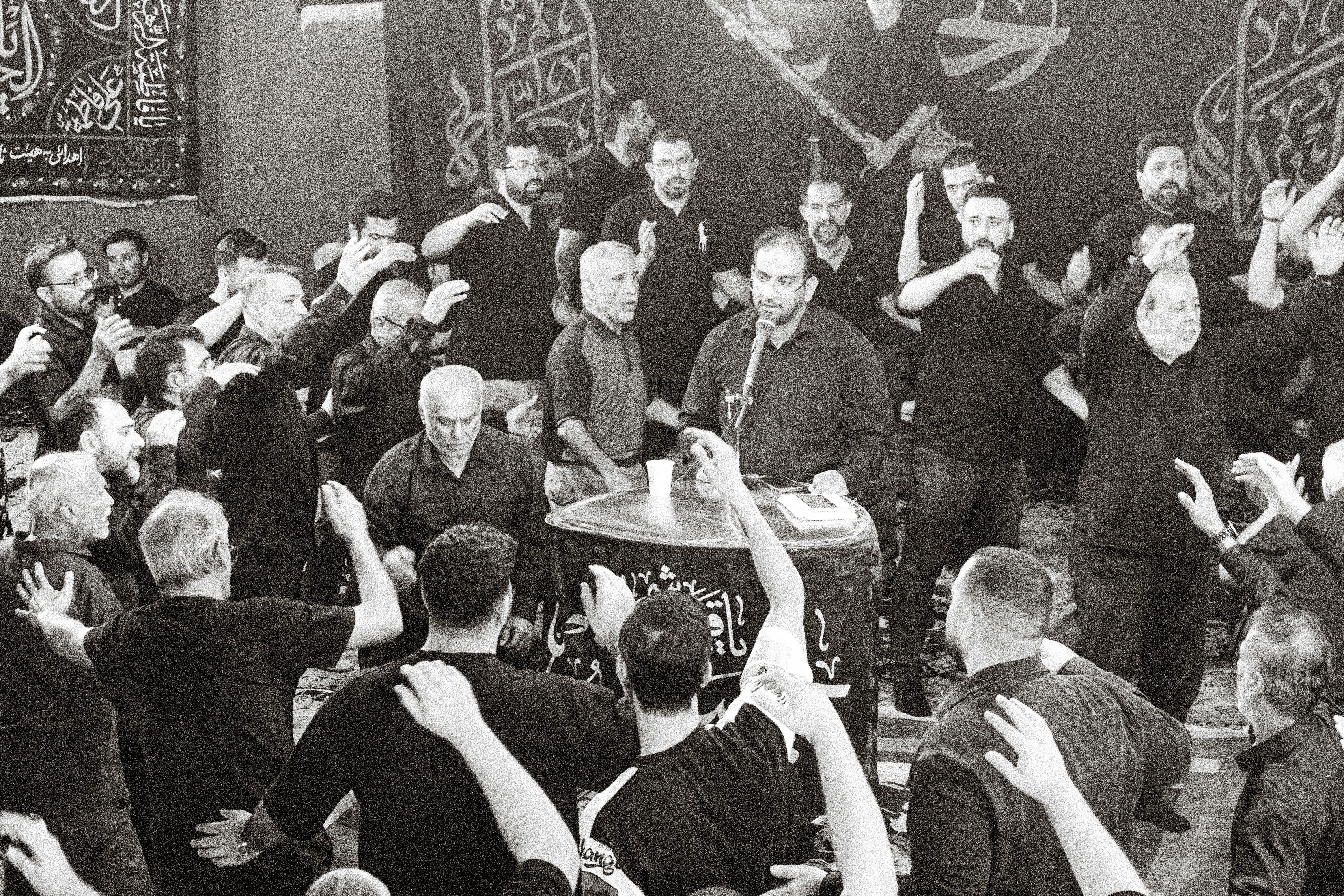 Voices at the Circular Podium: A Chaotic Gathering in a Shaded Hall