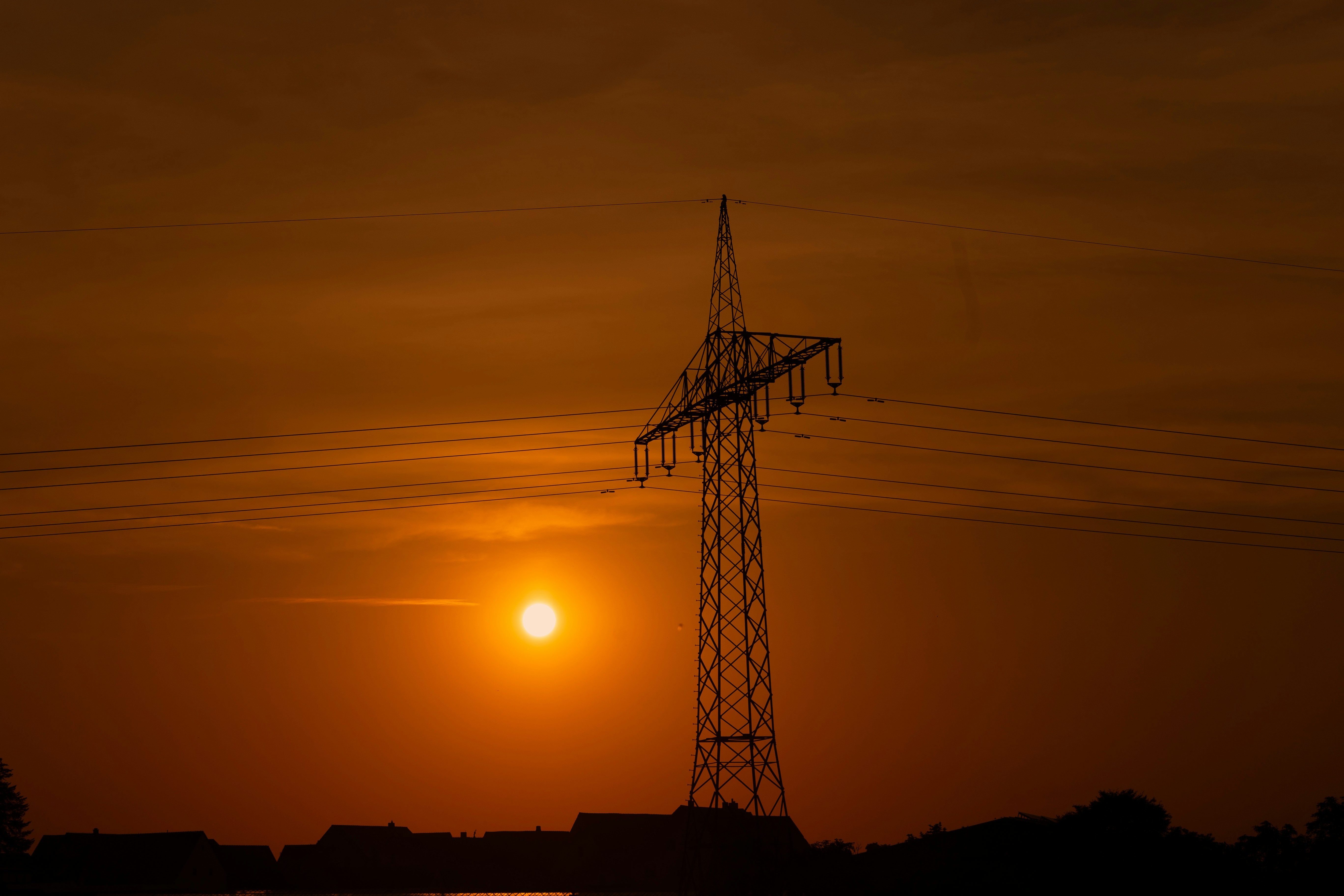 Sunset Pulse Behind a Steel Lattice