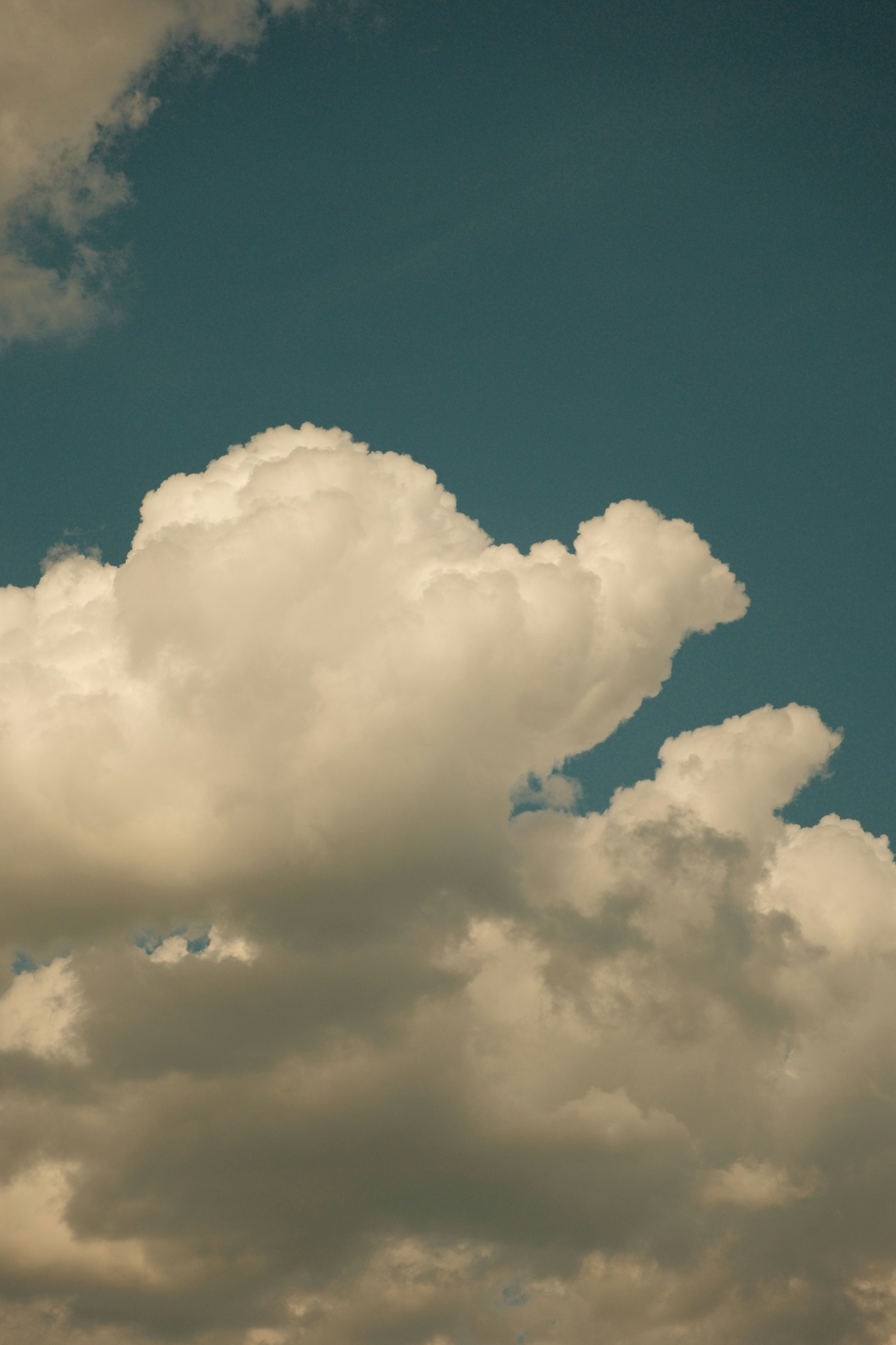 Cloud Cityscape: A Quiet Sky with Towering Cumulus