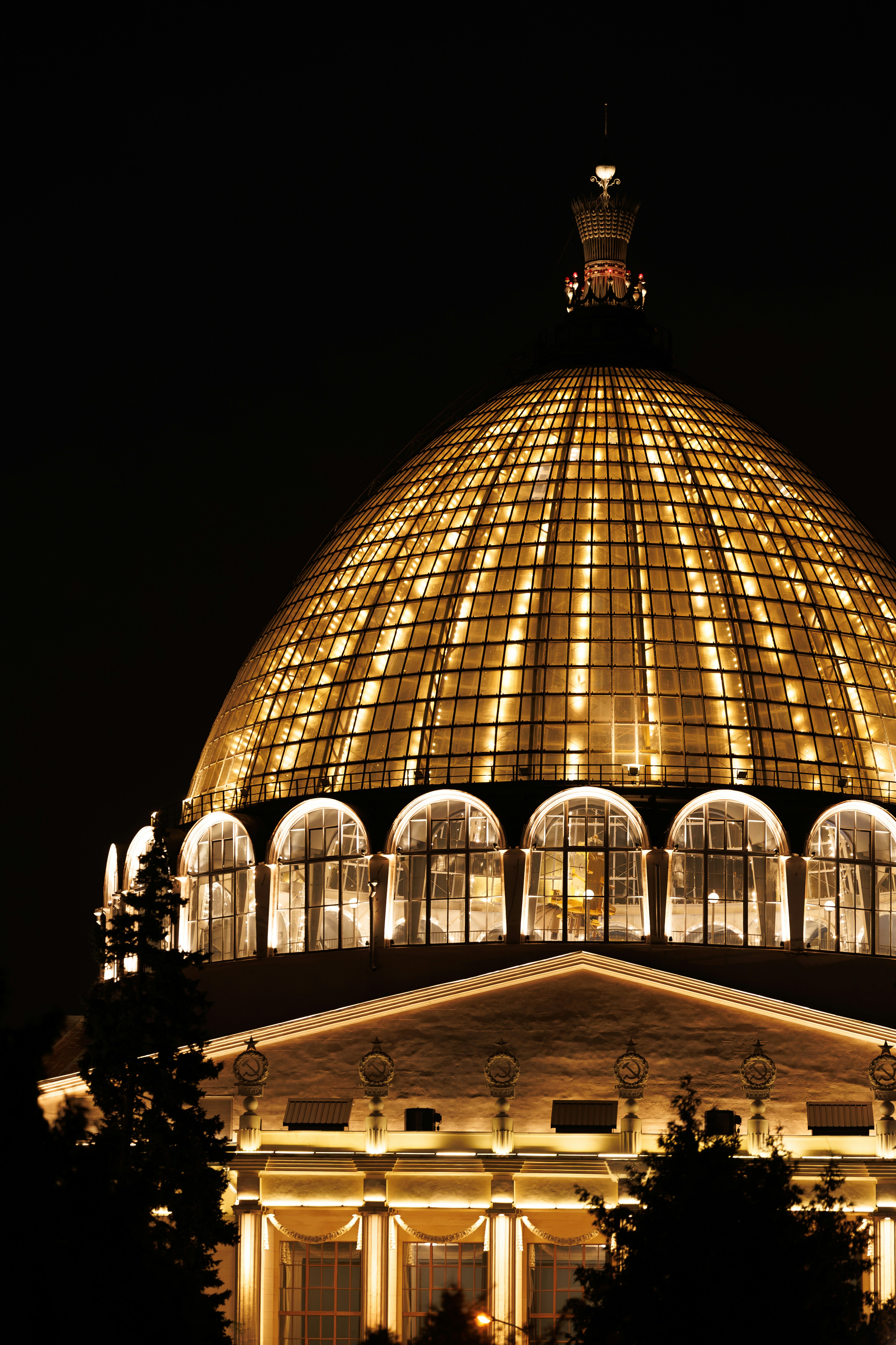 Golden Dome at Night: Illuminated Glass and Archway Symphony