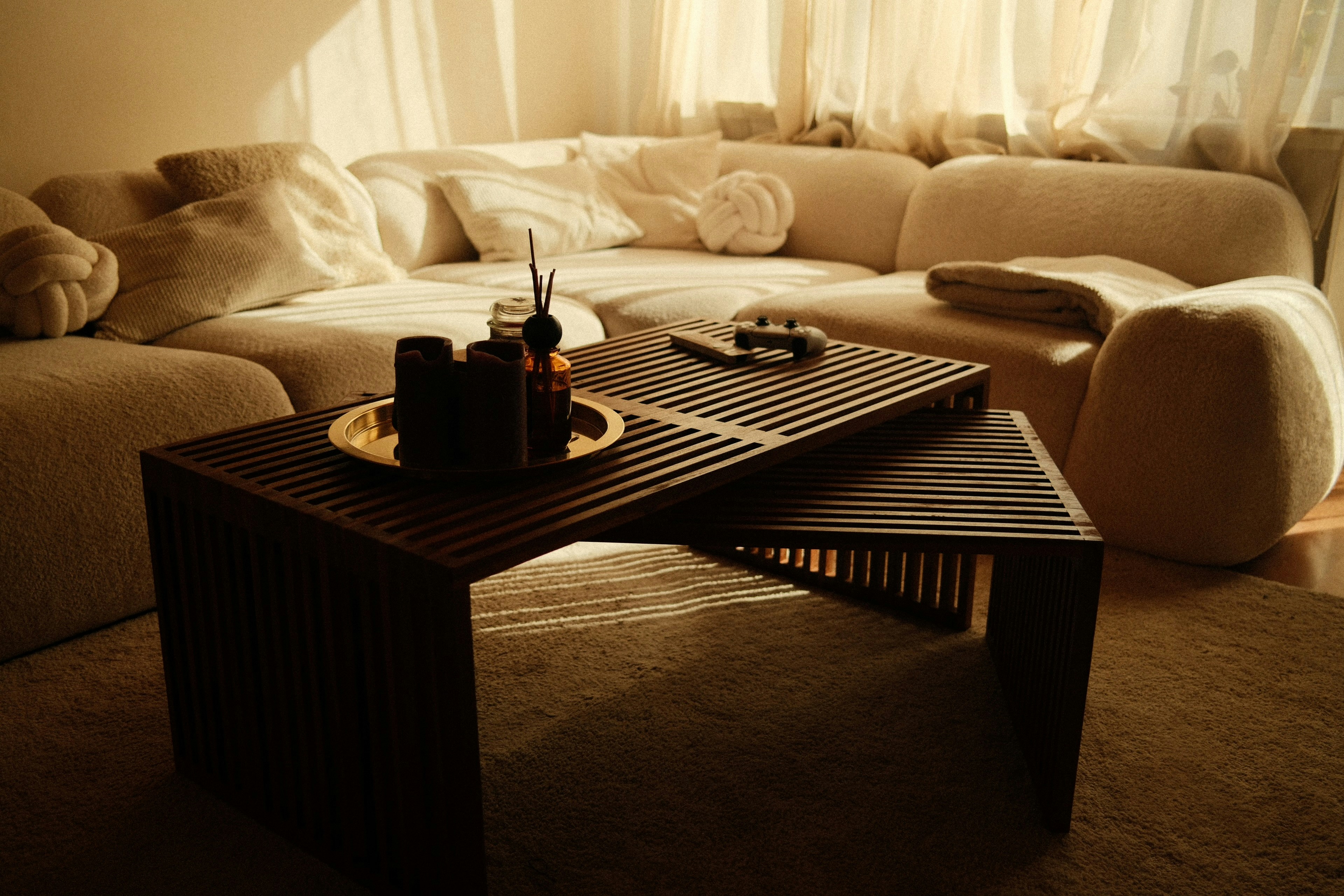 Deserted lounge: warm sepia light over a slatted coffee table
