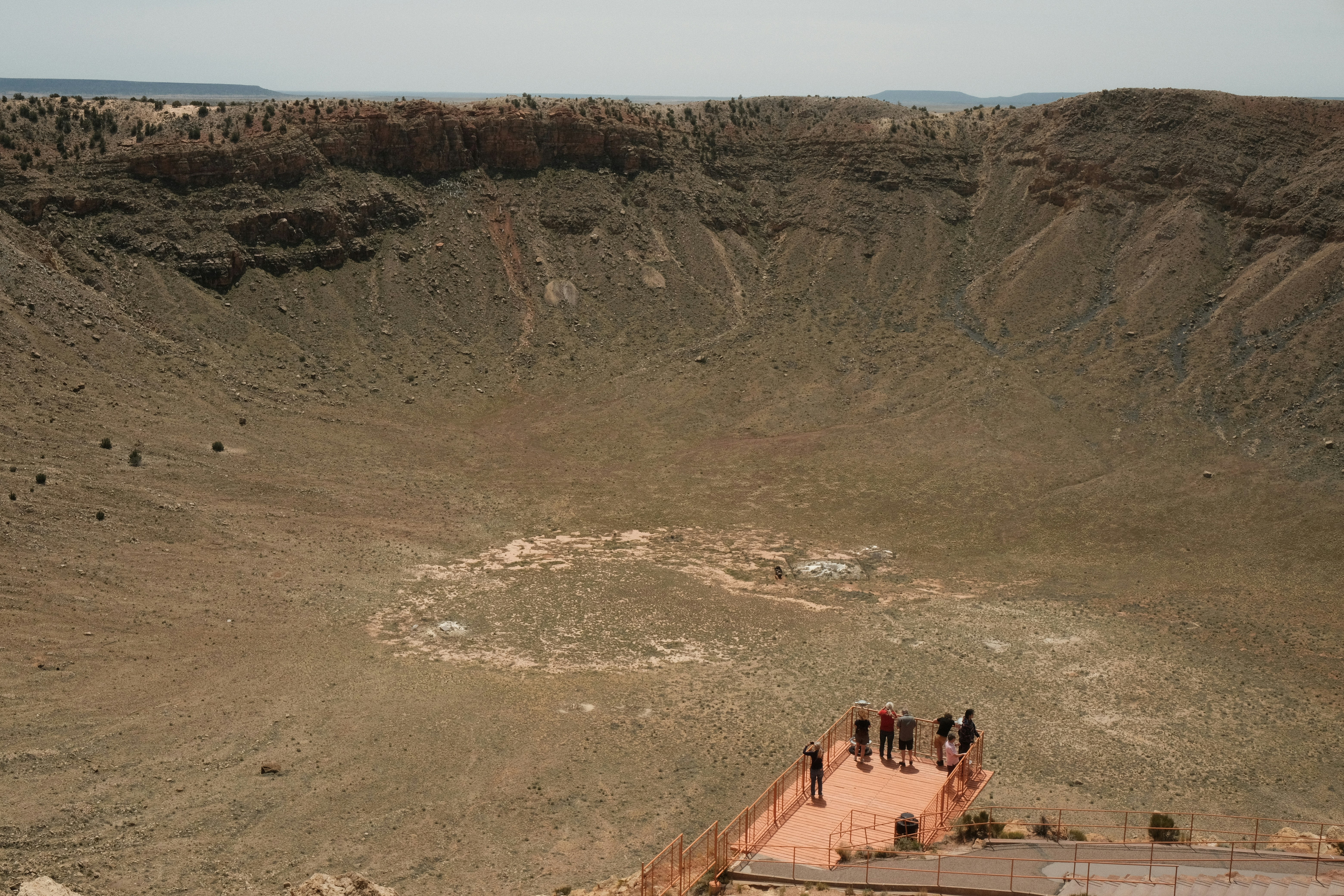 Circling the Rim: Visitors on a Crater Platform