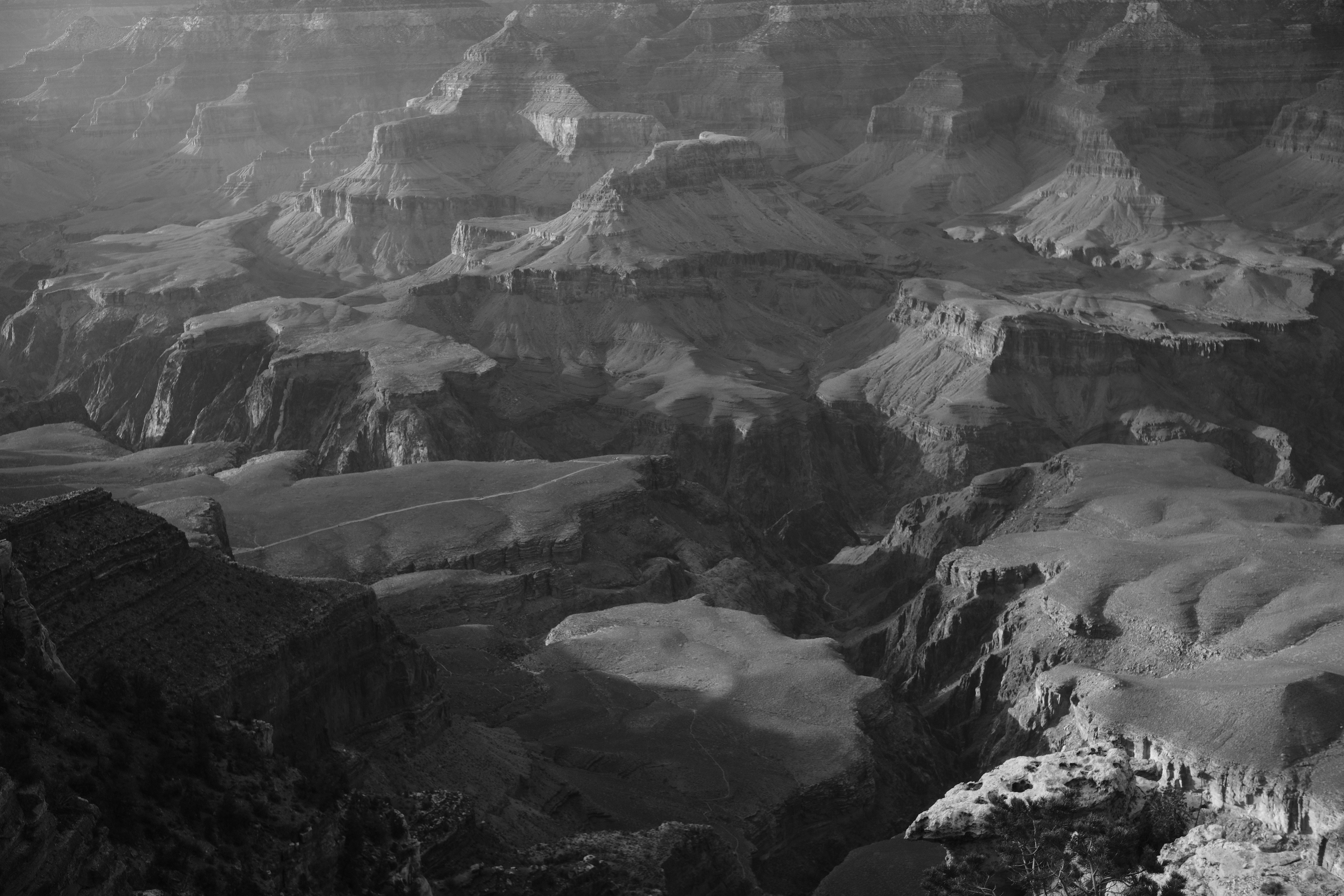 Rugged Snow-Crowned Valleys Beneath Somber Skies