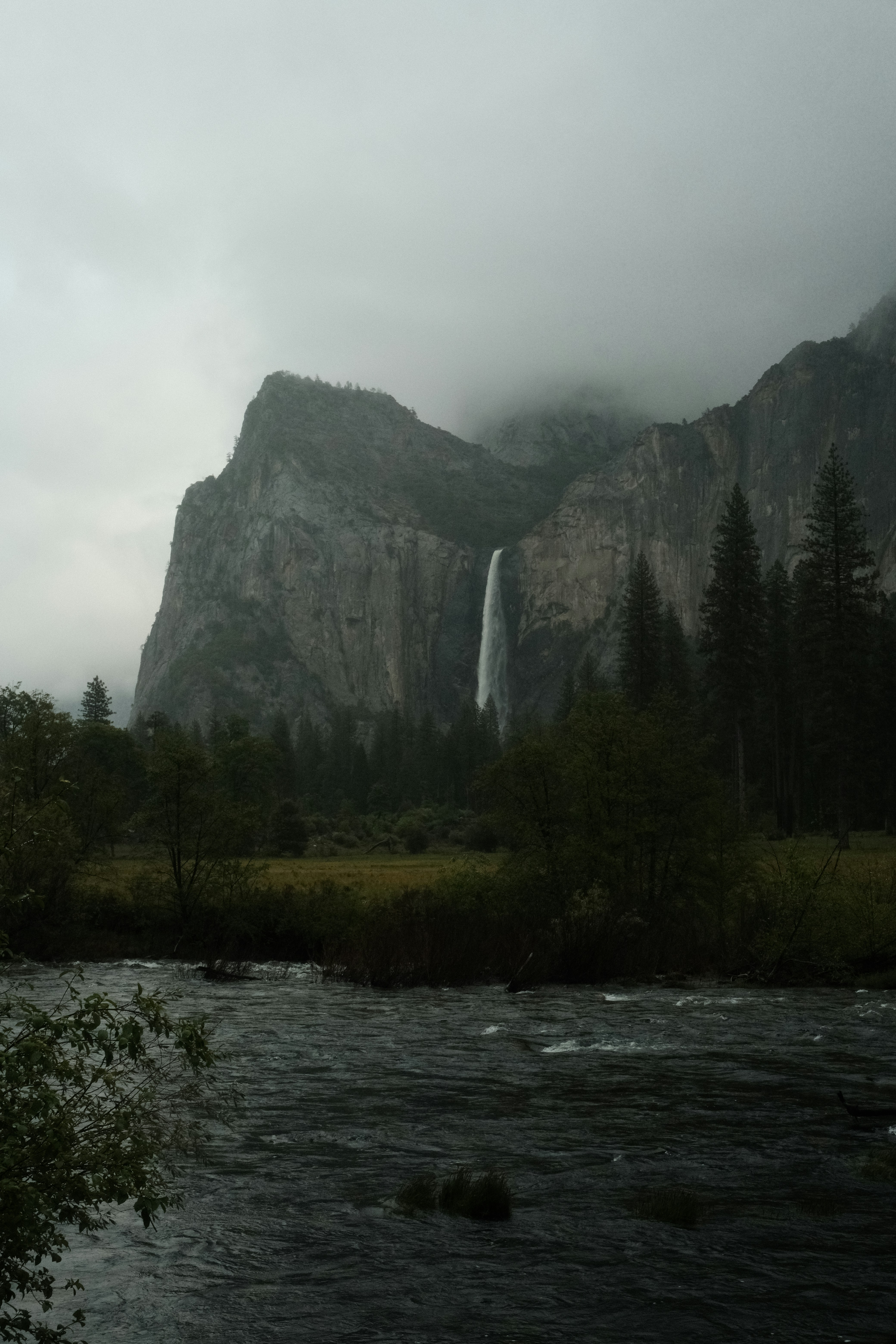 Mist Shrouded Peak with a Veiled Cascade